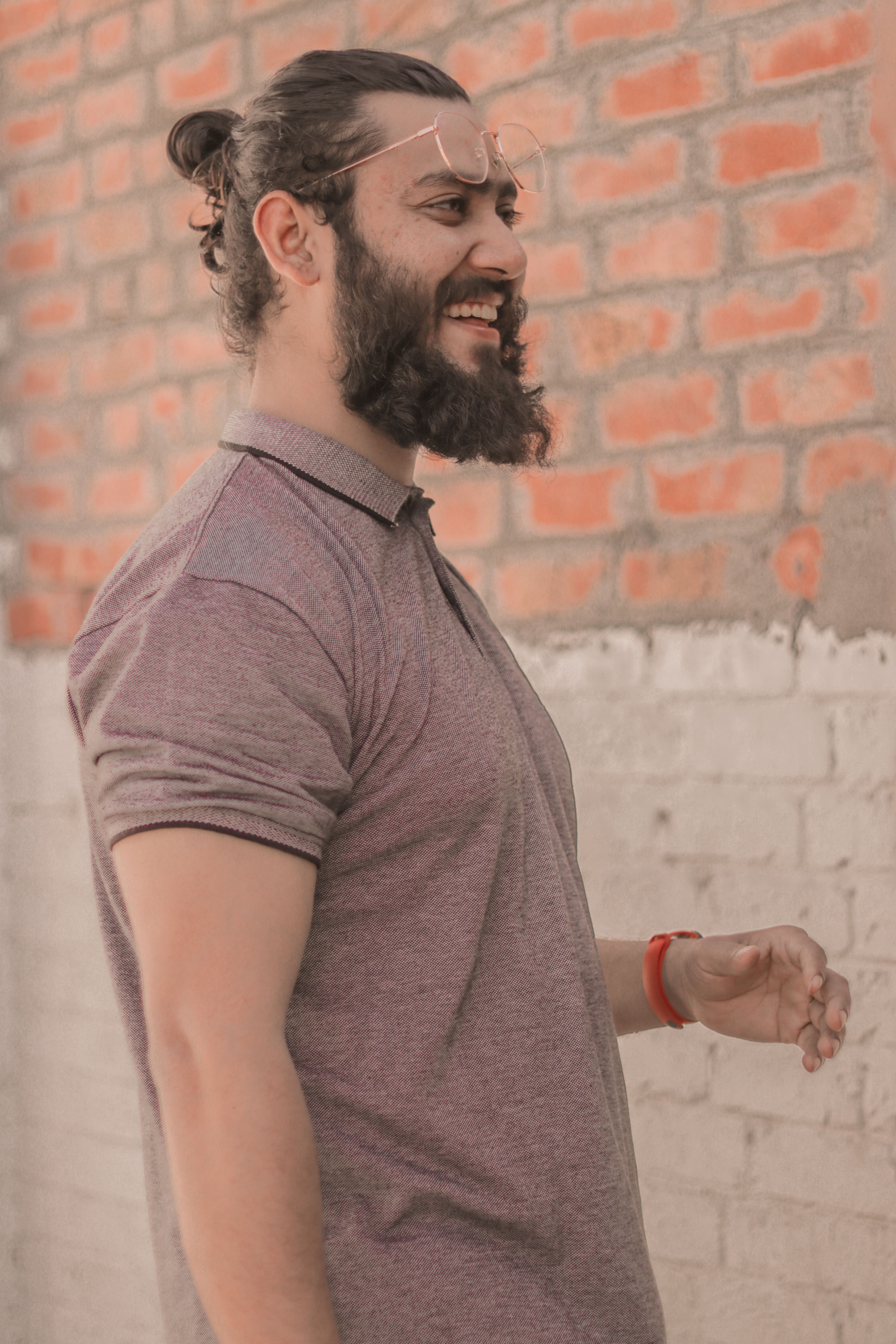 Woman and Man Posing Together by Wall · Free Stock Photo