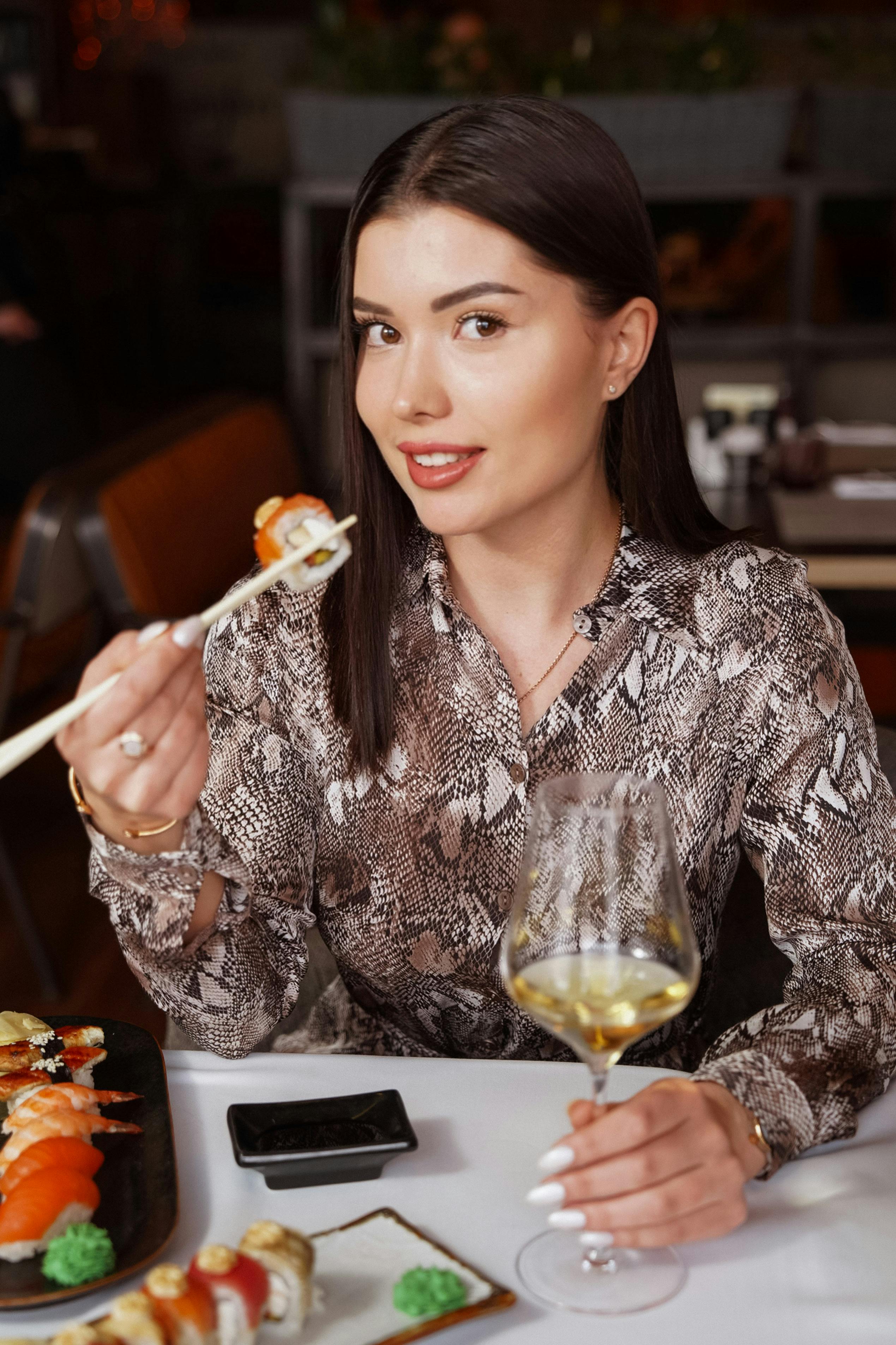 Woman Eating Fish in Restaurant · Free Stock Photo
