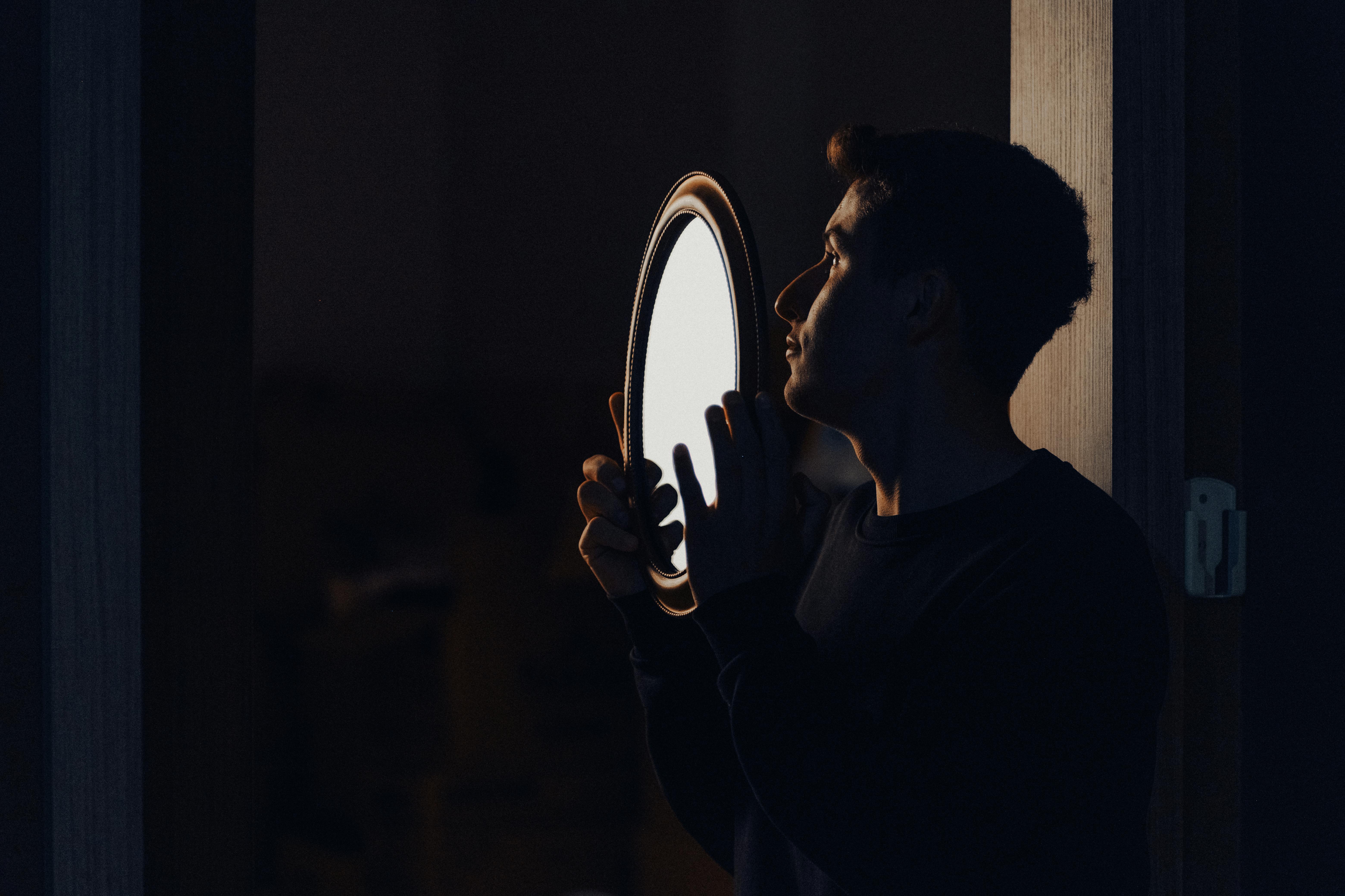 Man Holding Mirror · Free Stock Photo