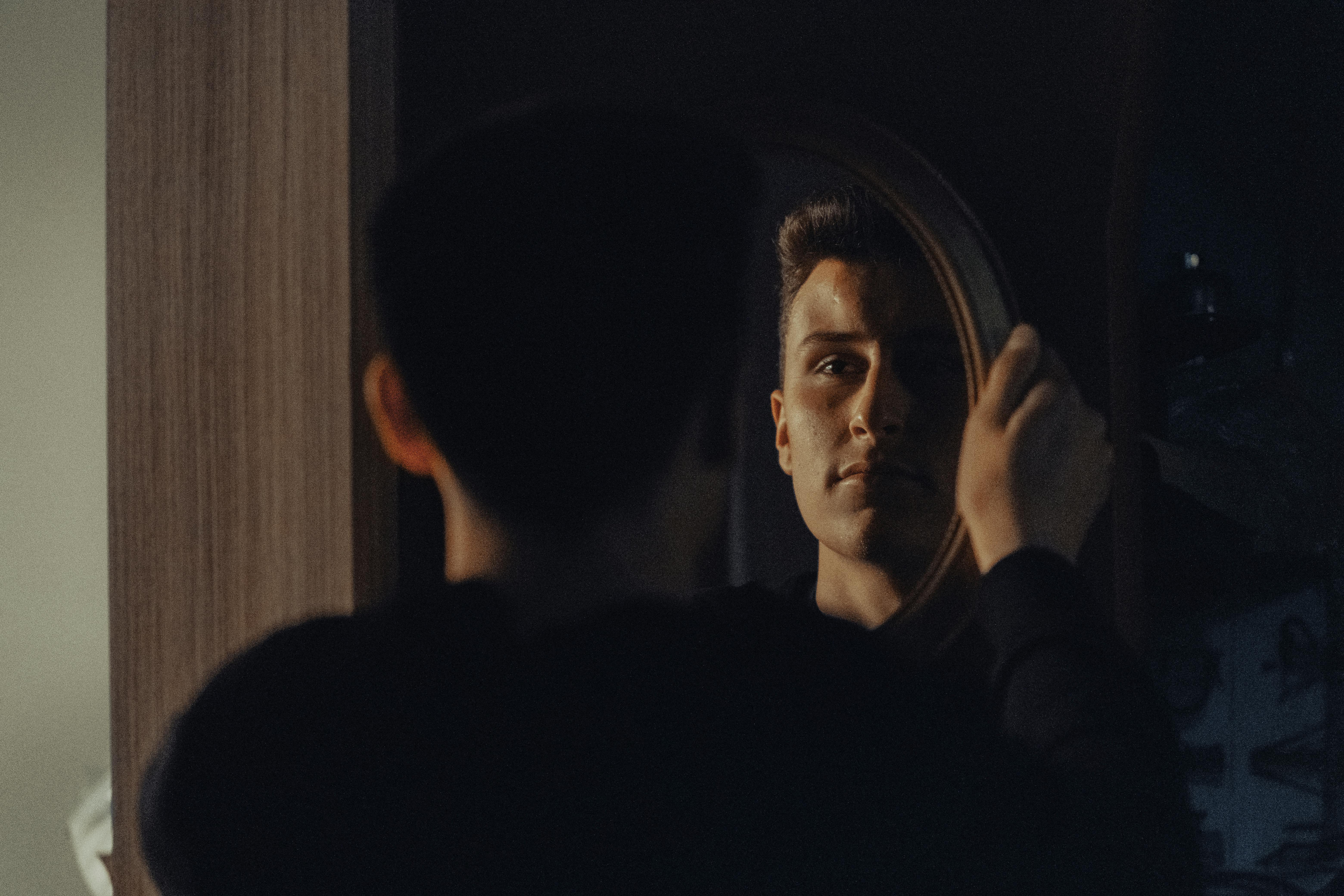Man Reflecting in Mirror · Free Stock Photo