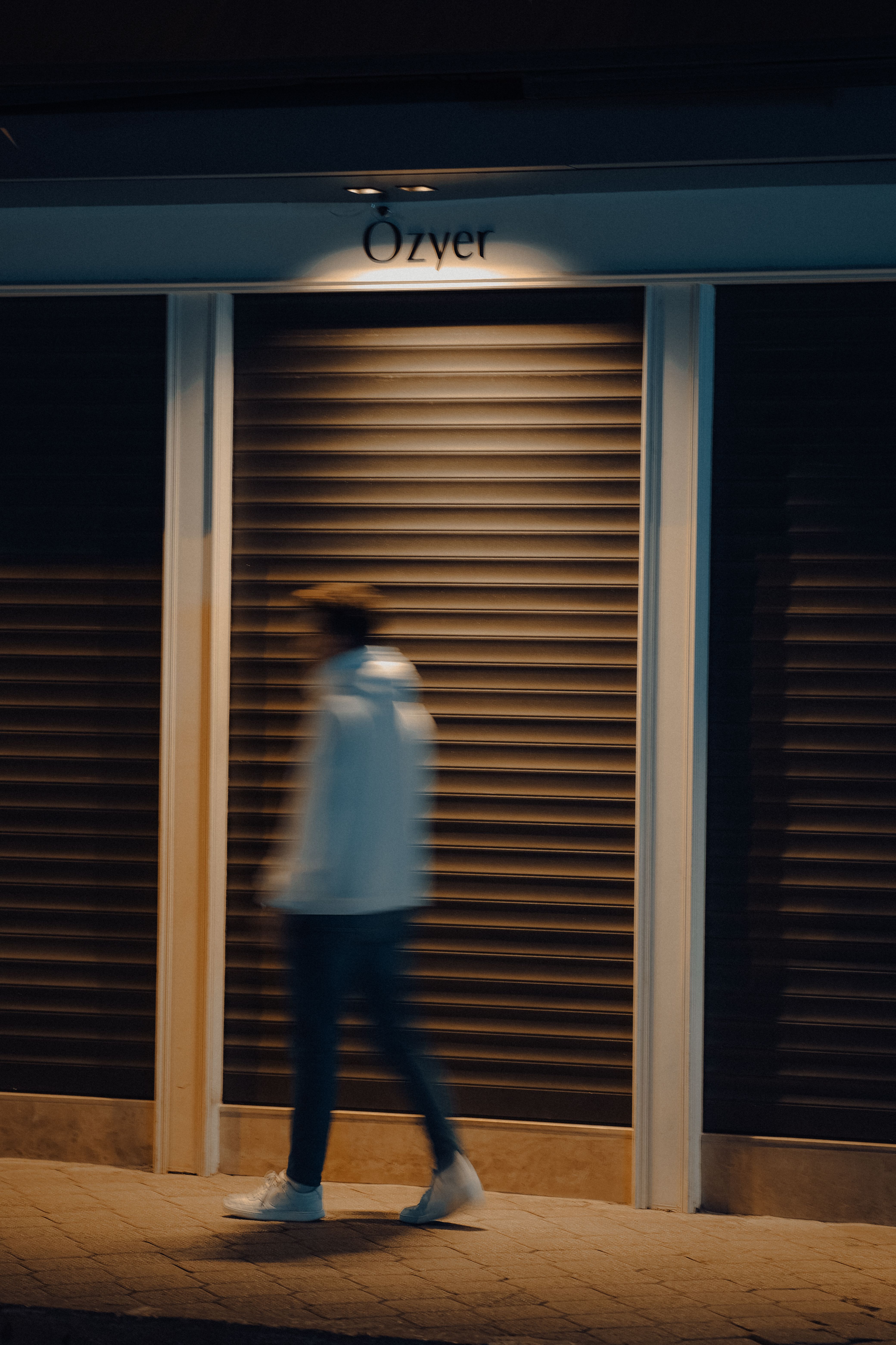 Blurred Man in Light in Town at Night · Free Stock Photo