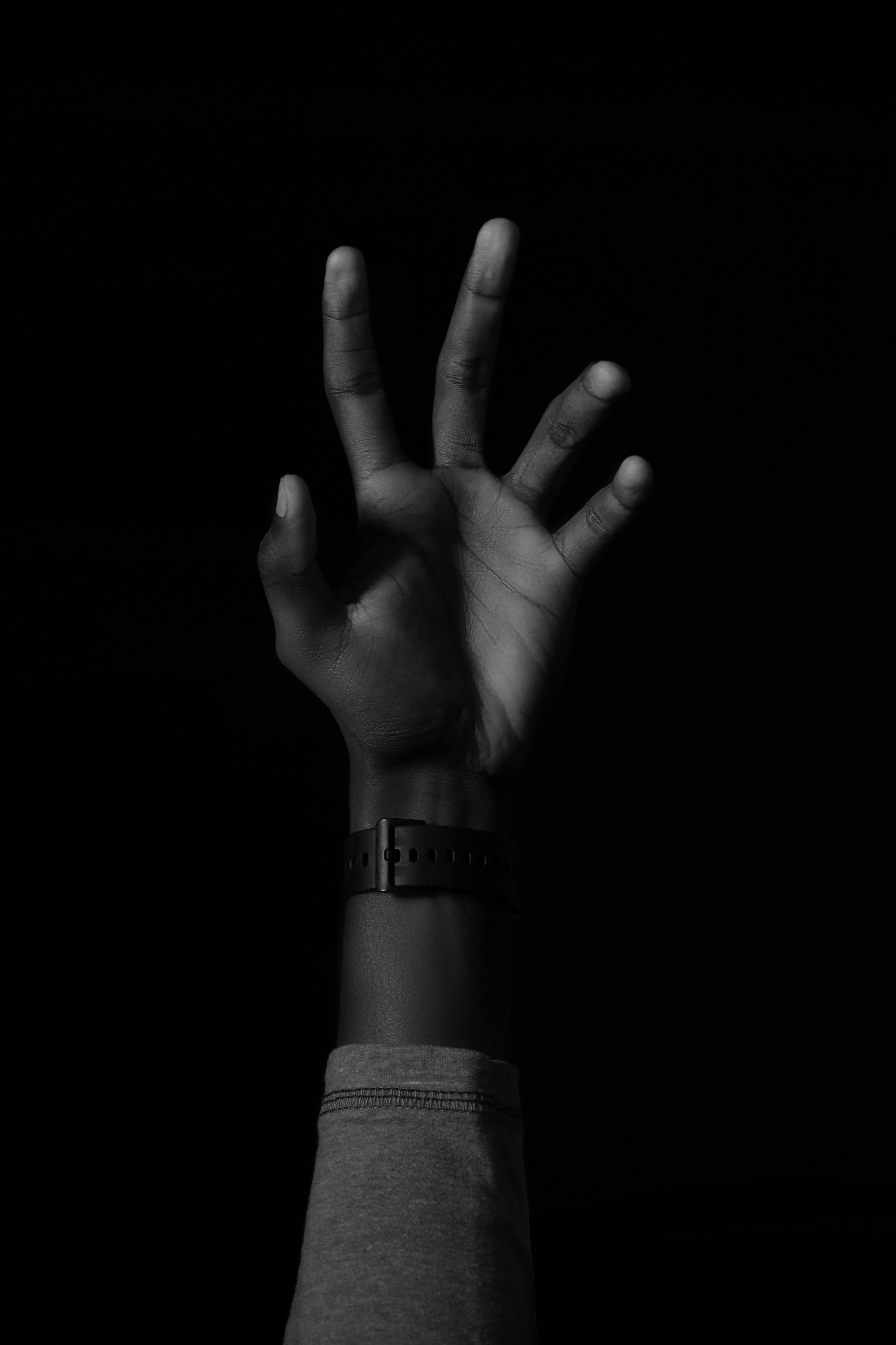 A Close-Up Shot of Interlocked Fingers · Free Stock Photo