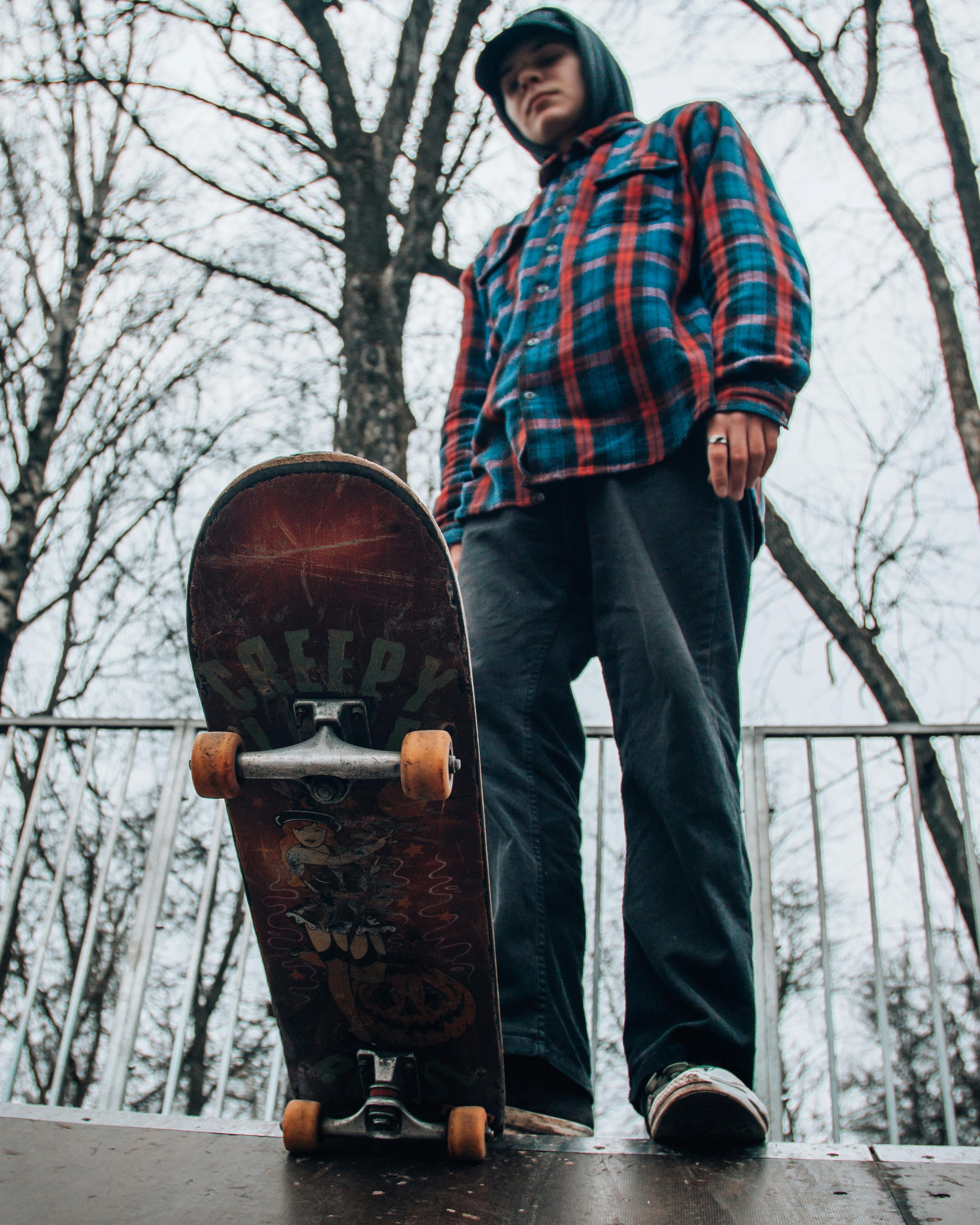 Man with Skateboard at Edge of Ramp · Free Stock Photo