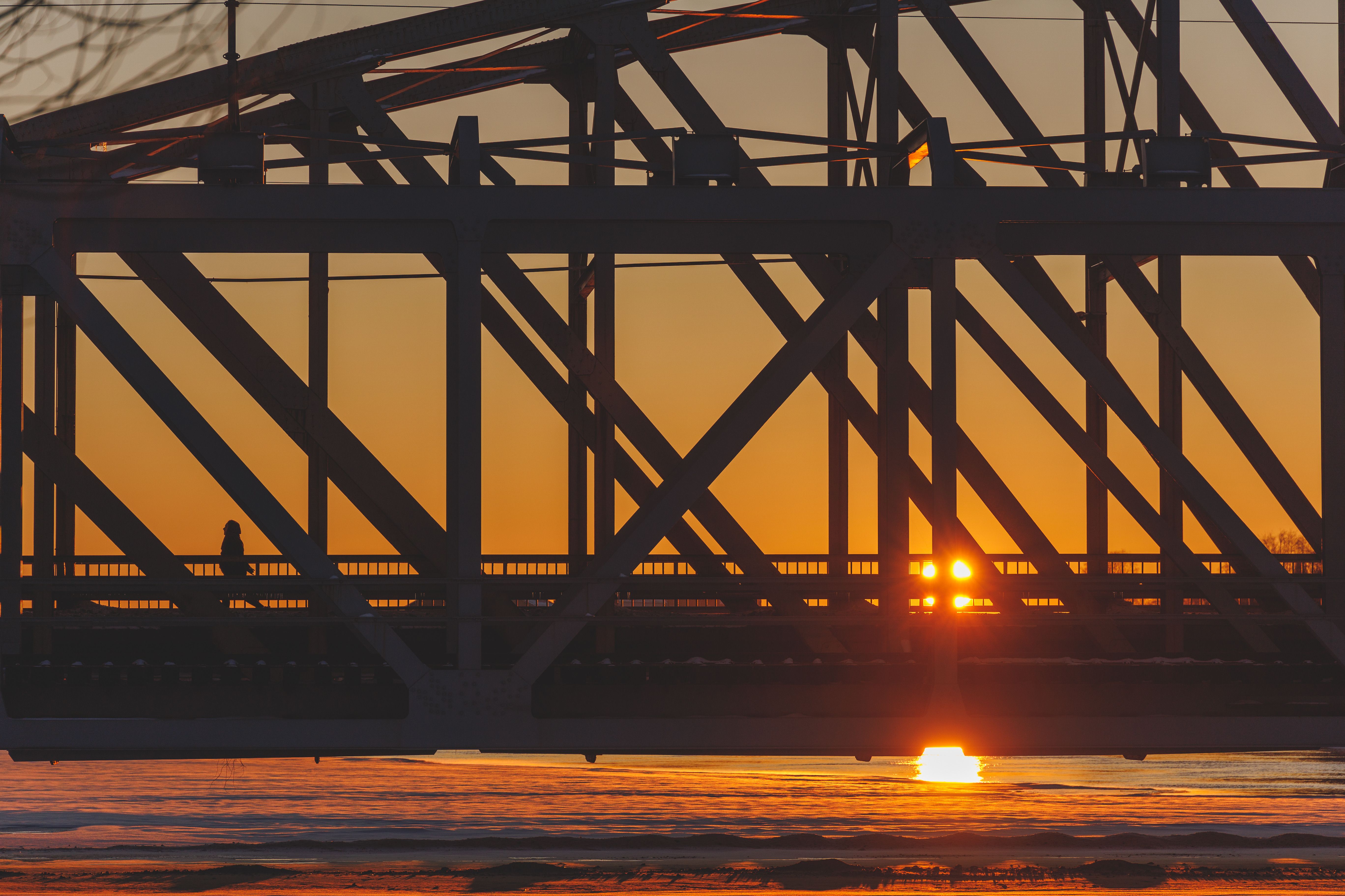 Silhouette of Bridge across River at Sunset · Free Stock Photo