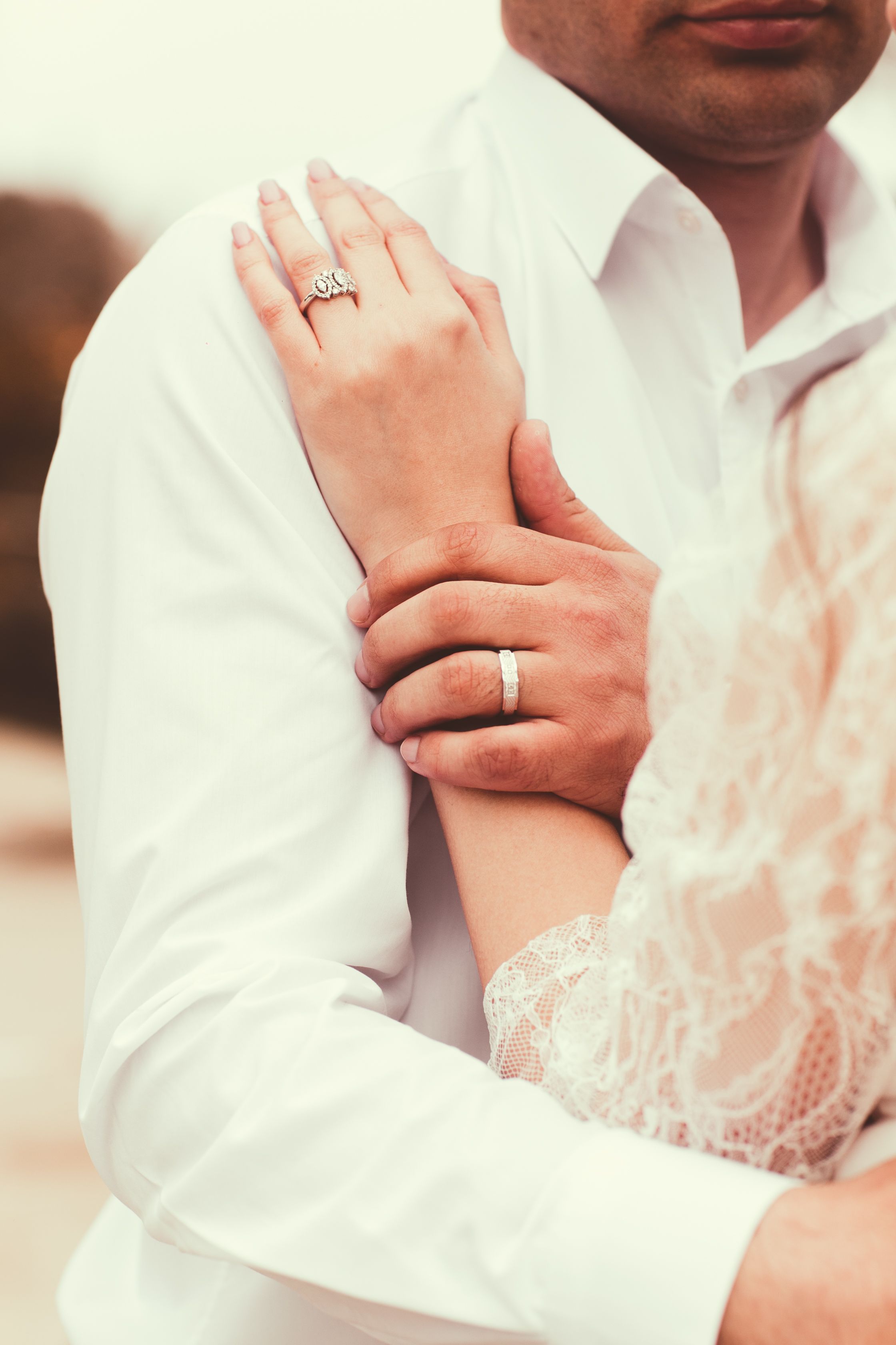 Womans Hand on a Mans Shoulder · Free Stock Photo