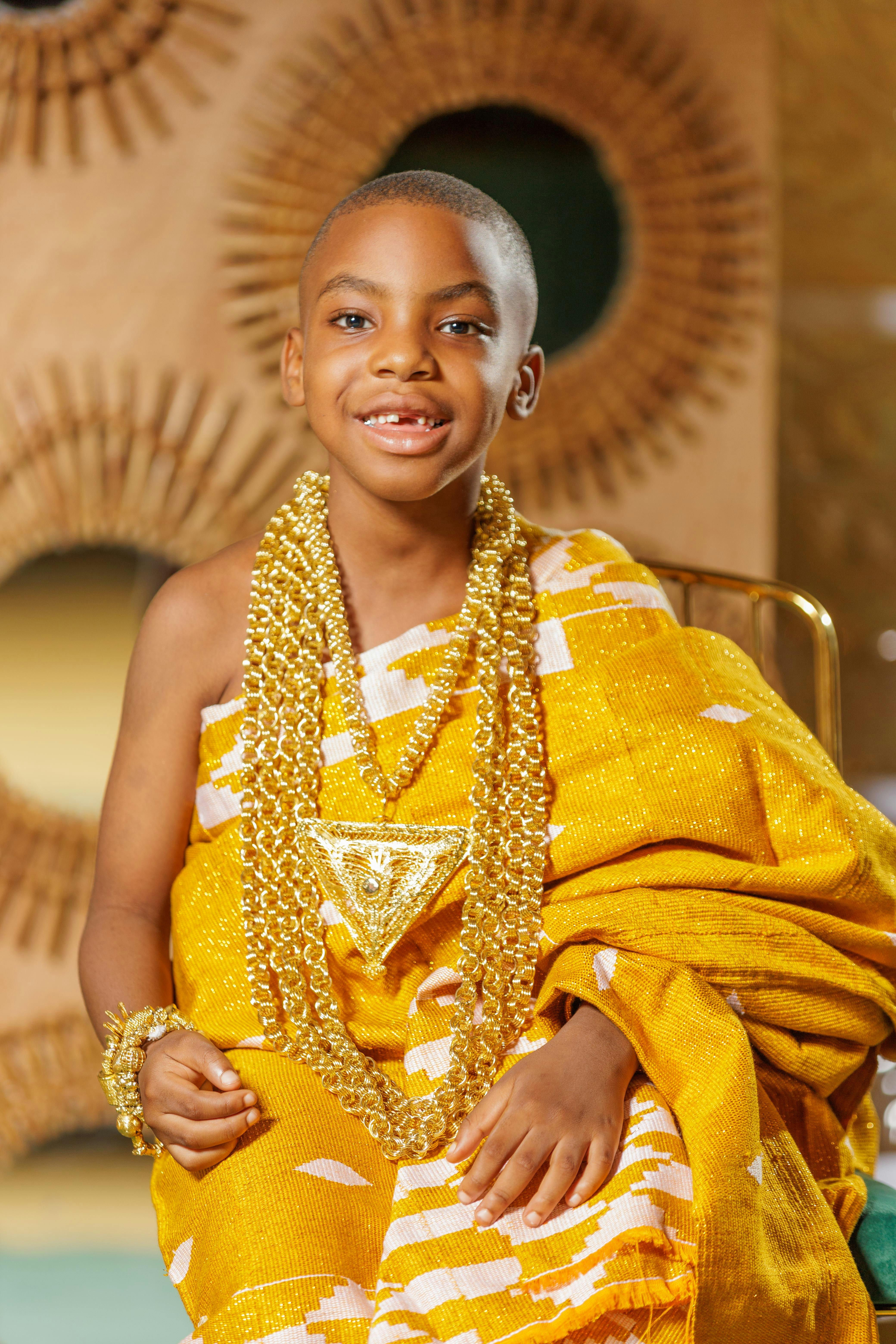 Boy in Traditional Robes and with Garlands · Free Stock Photo