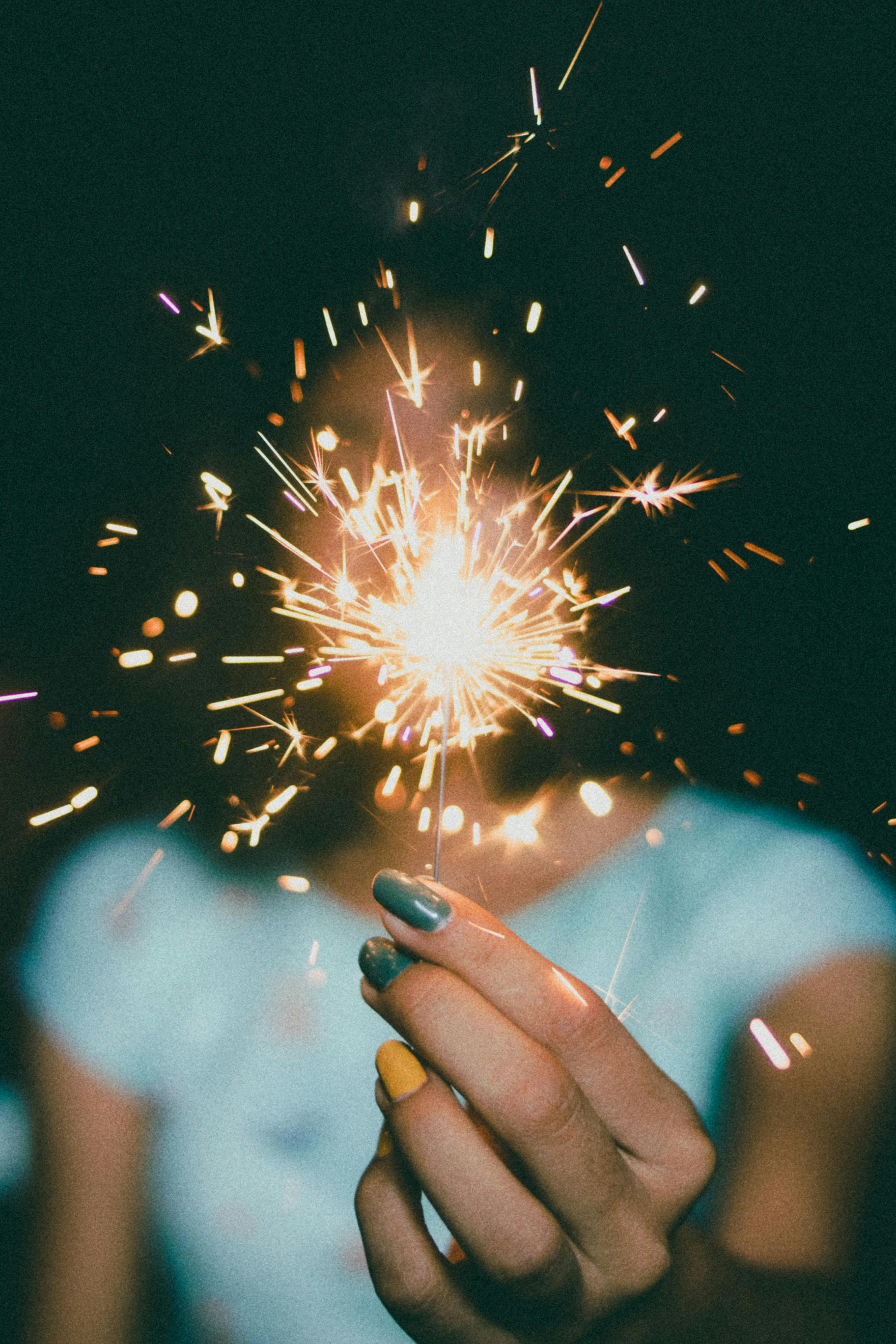 Woman Holding Sparkle · Free Stock Photo