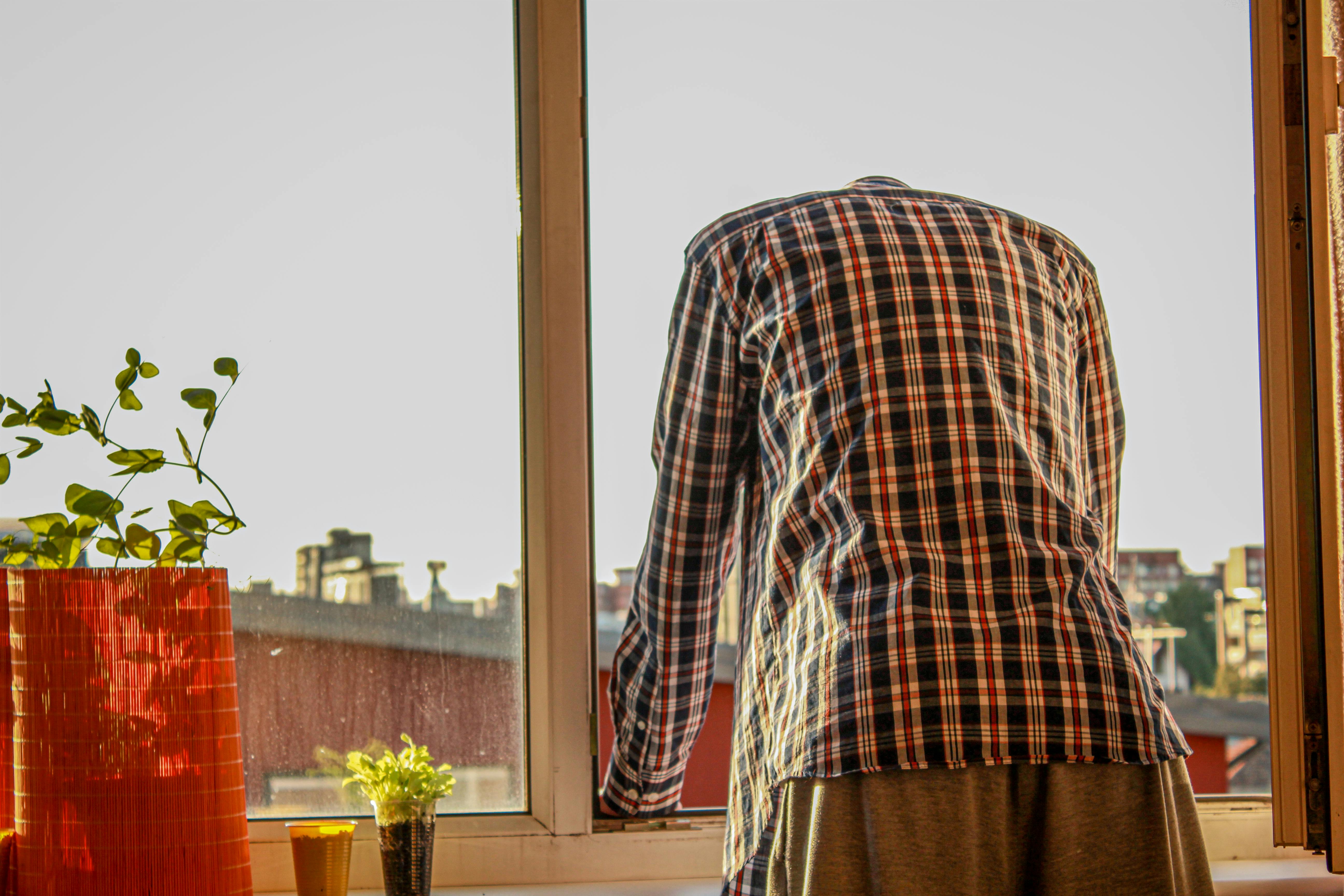 Man Looking Down through Window · Free Stock Photo