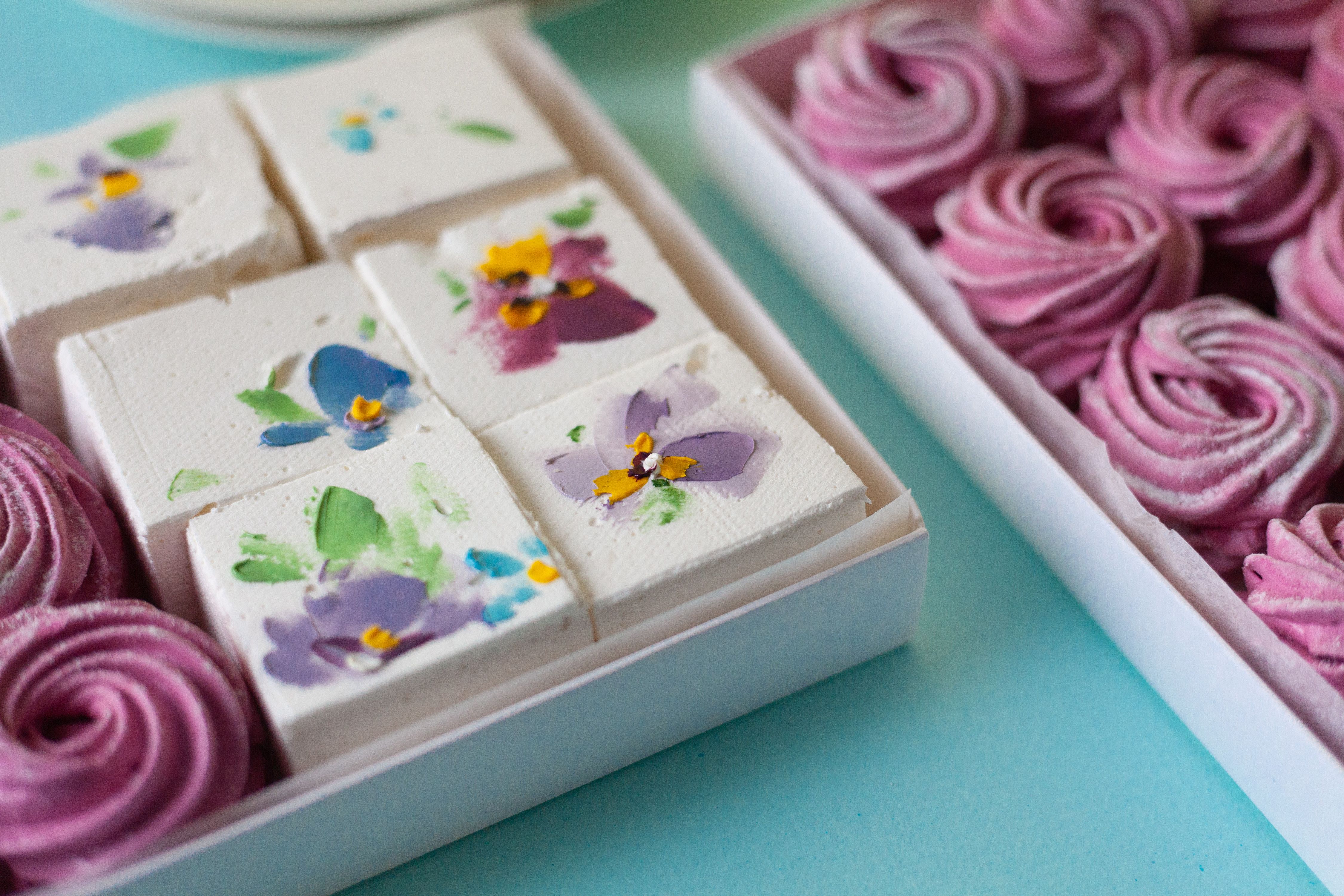 Still Life with Decorative Sweets and Flowers on a Table · Free Stock Photo