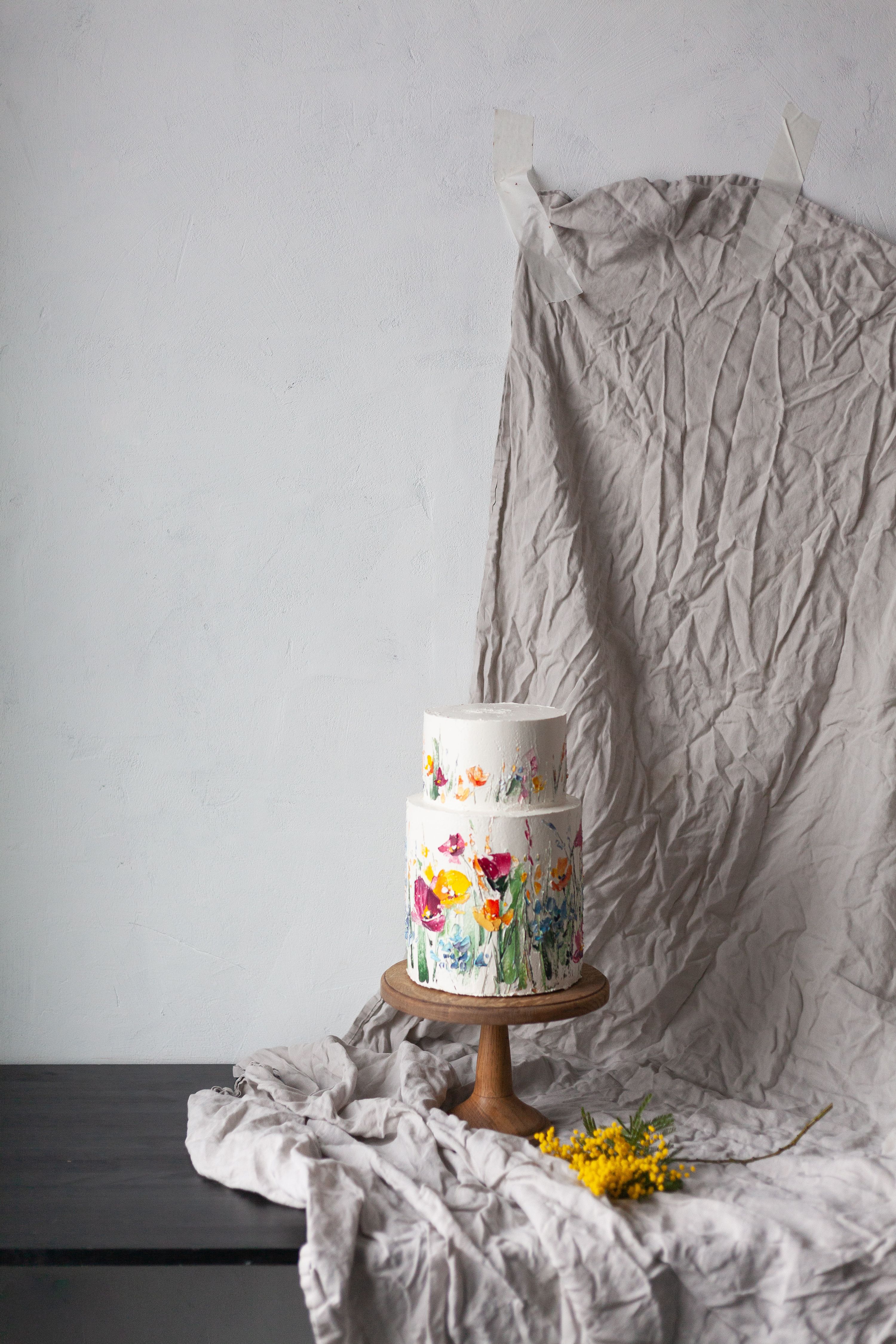 Still Life with a Floral Decorative Cake on a Gray Drape · Free Stock Photo