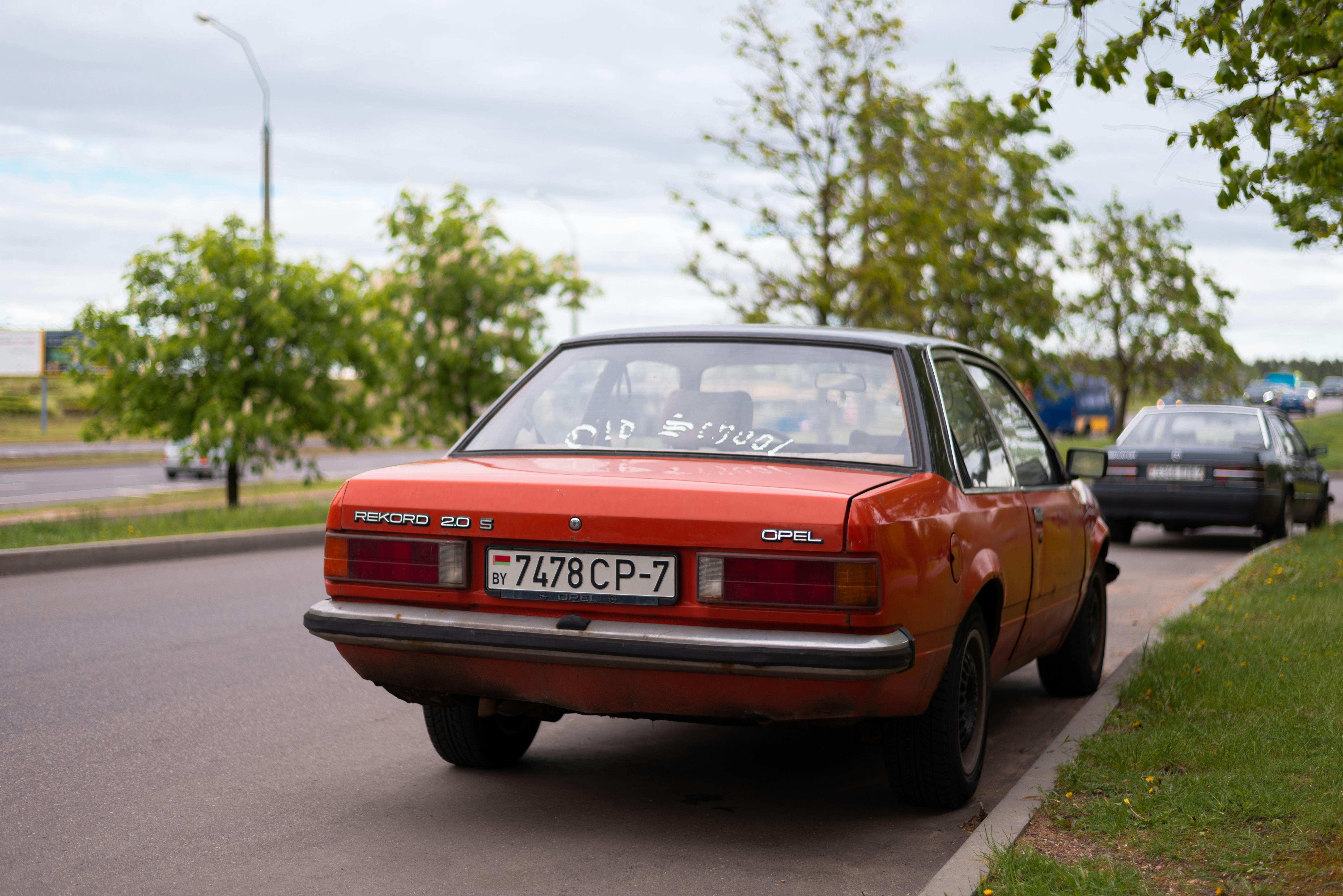 Close-up Photo of Blue Vehicle on Street · Free Stock Photo