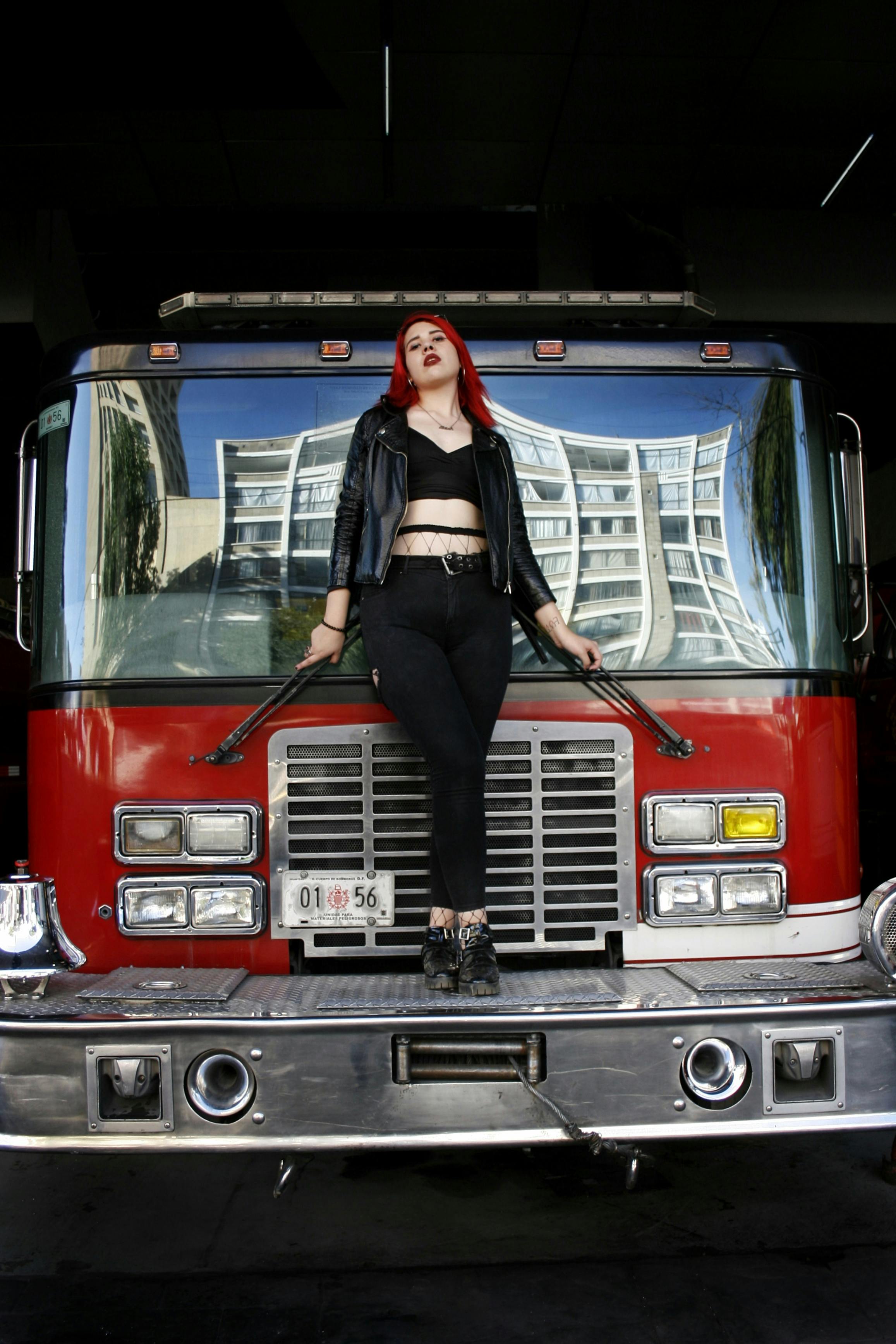 Woman Posing on Firetruck · Free Stock Photo