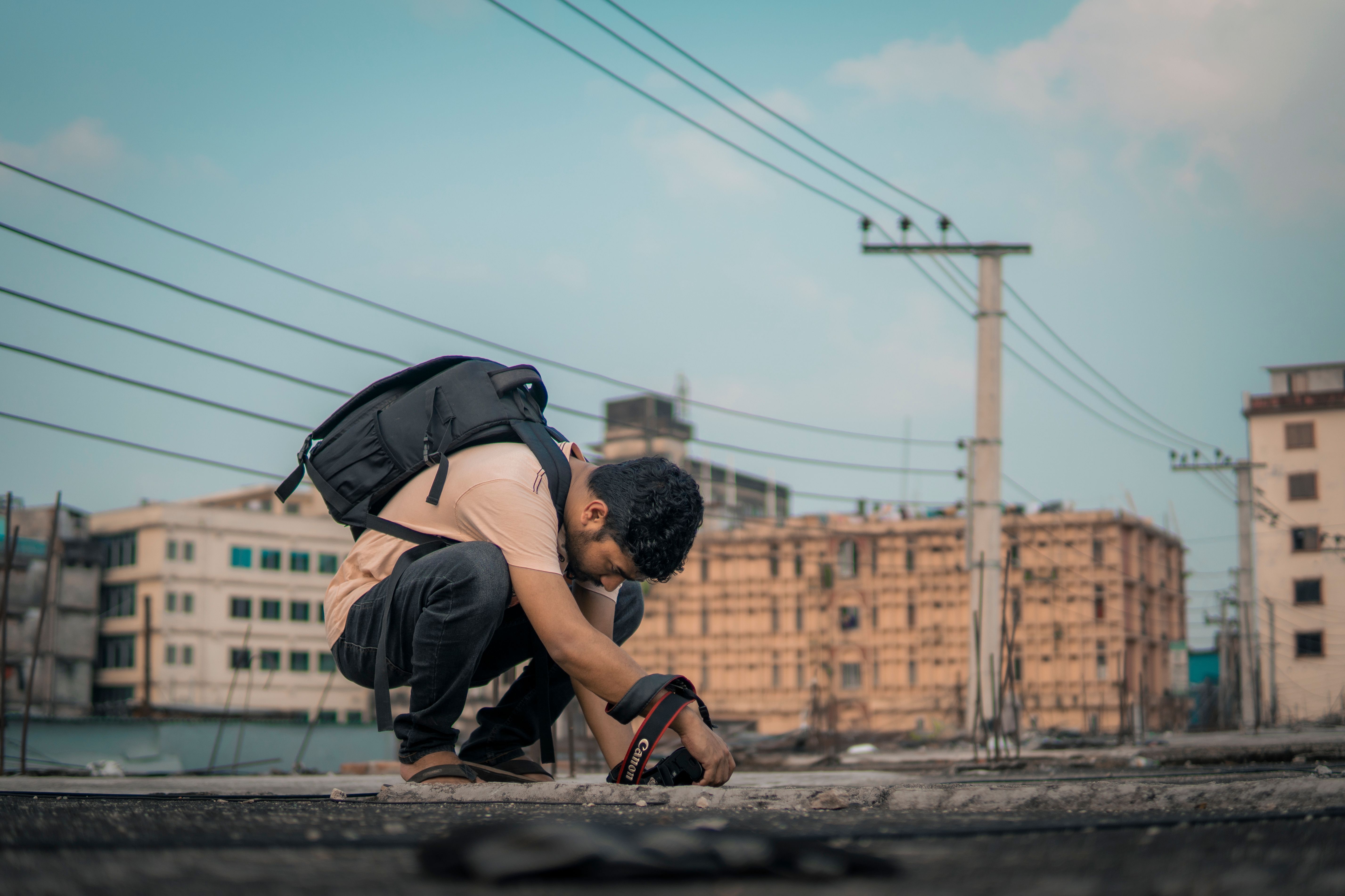 A Photographer Taking a Picture of the City from a Low Angle · Free ...