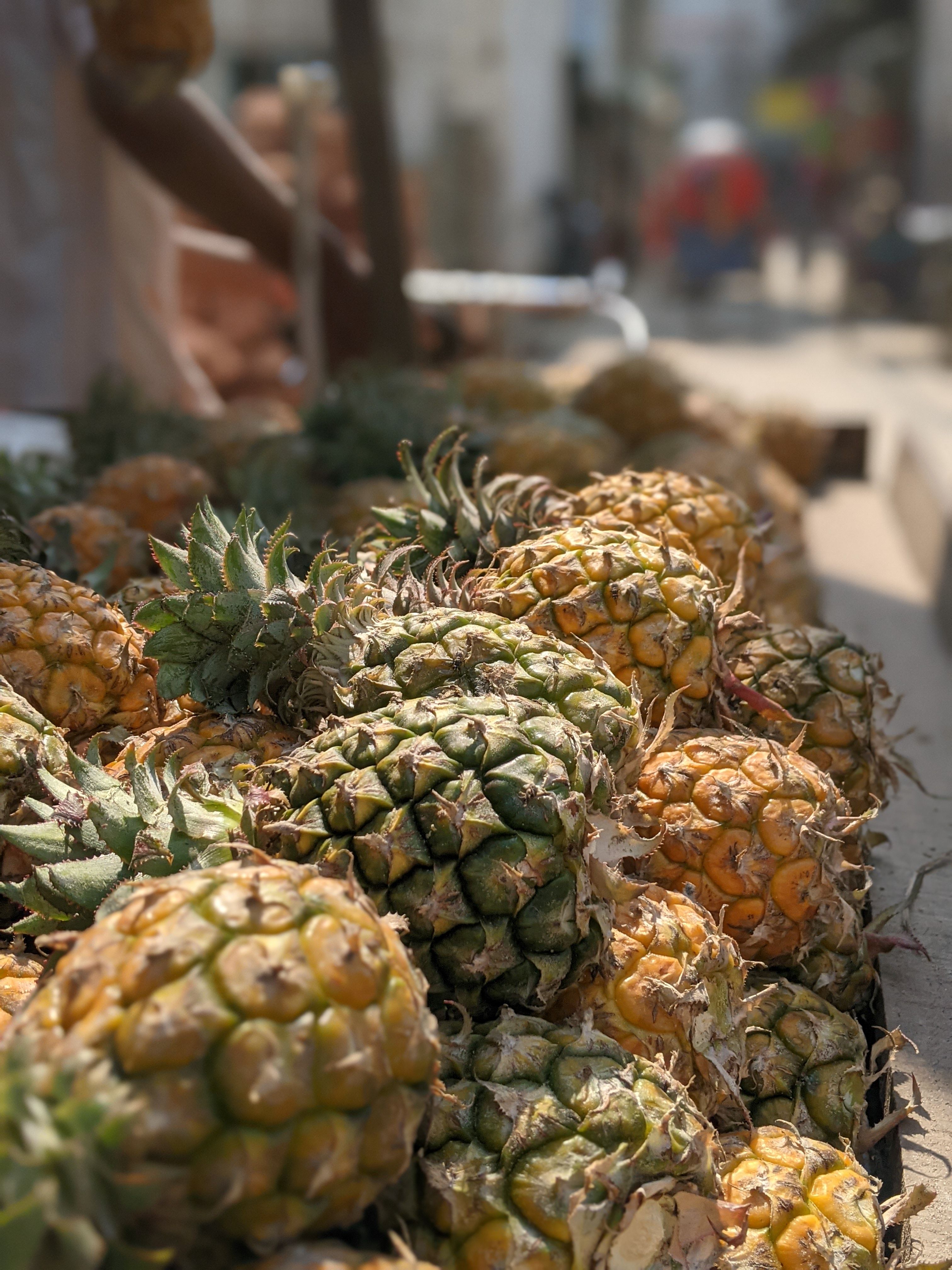 Close-up of a Bunch of Pineapples on the Market Stall · Free Stock Photo