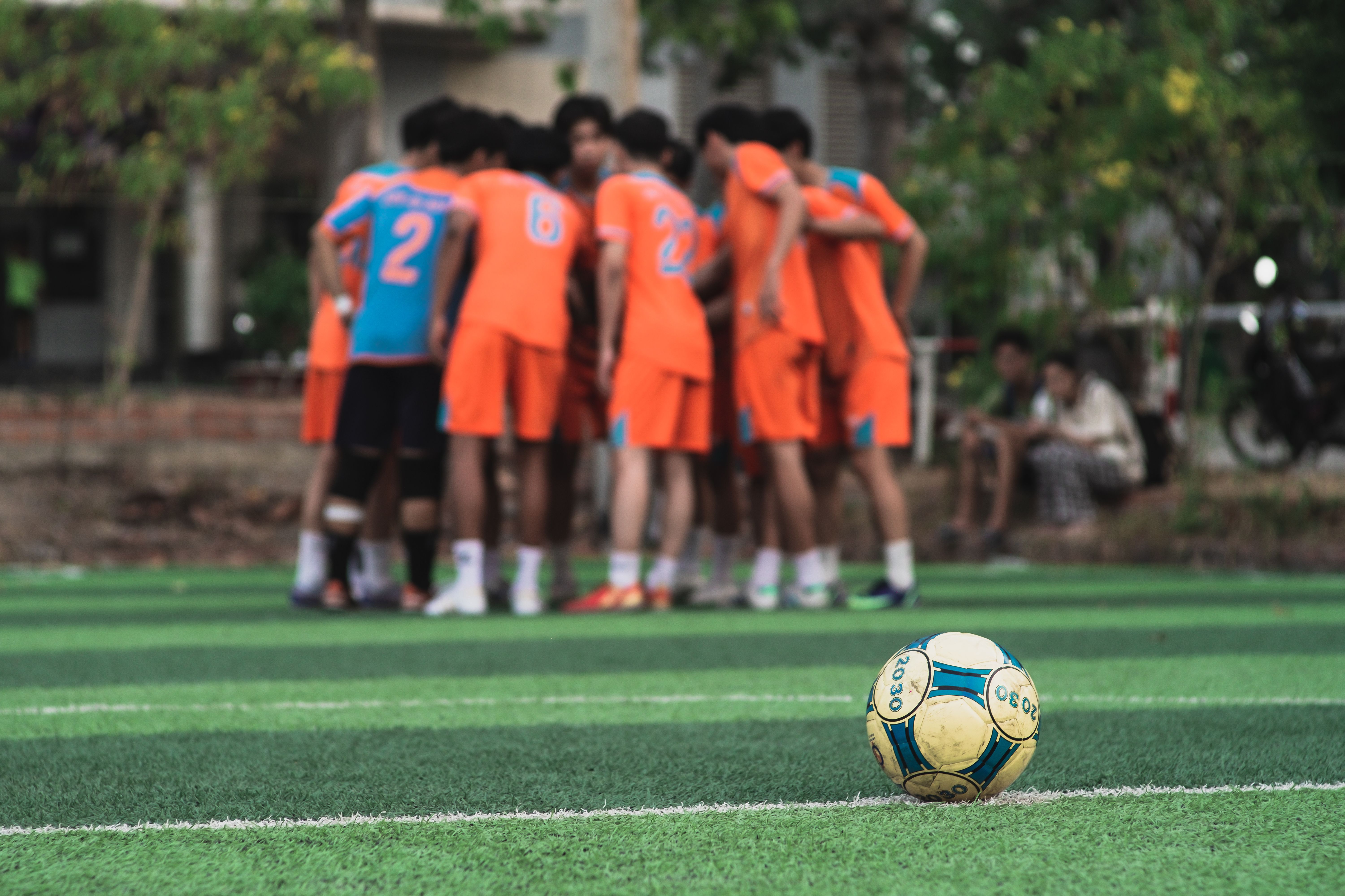 Ball and Players behind · Free Stock Photo