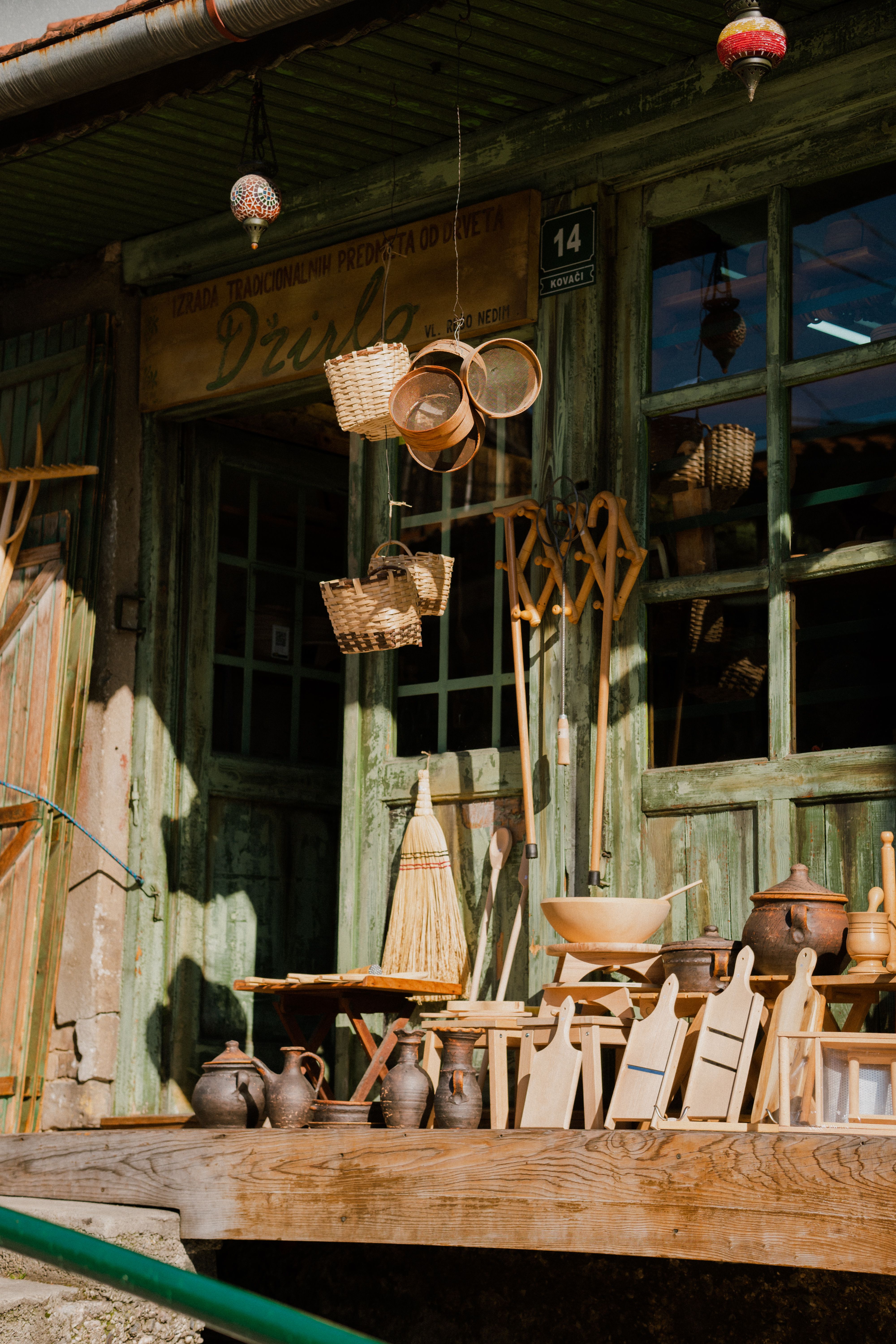 Handmade Pottery and Wooden Kitchen Accessories Standing on Display in ...