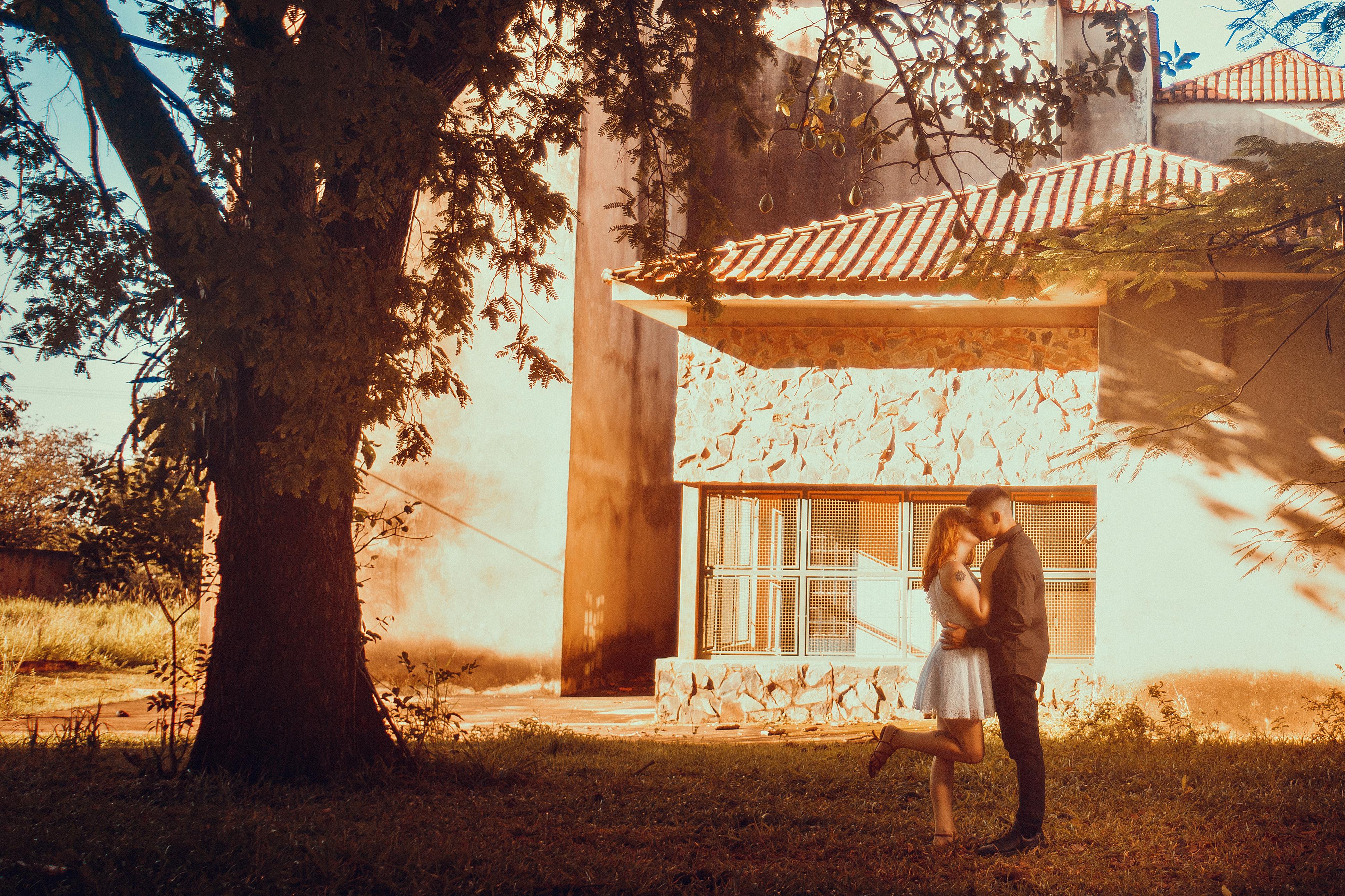 Couple Hugging by Building · Free Stock Photo