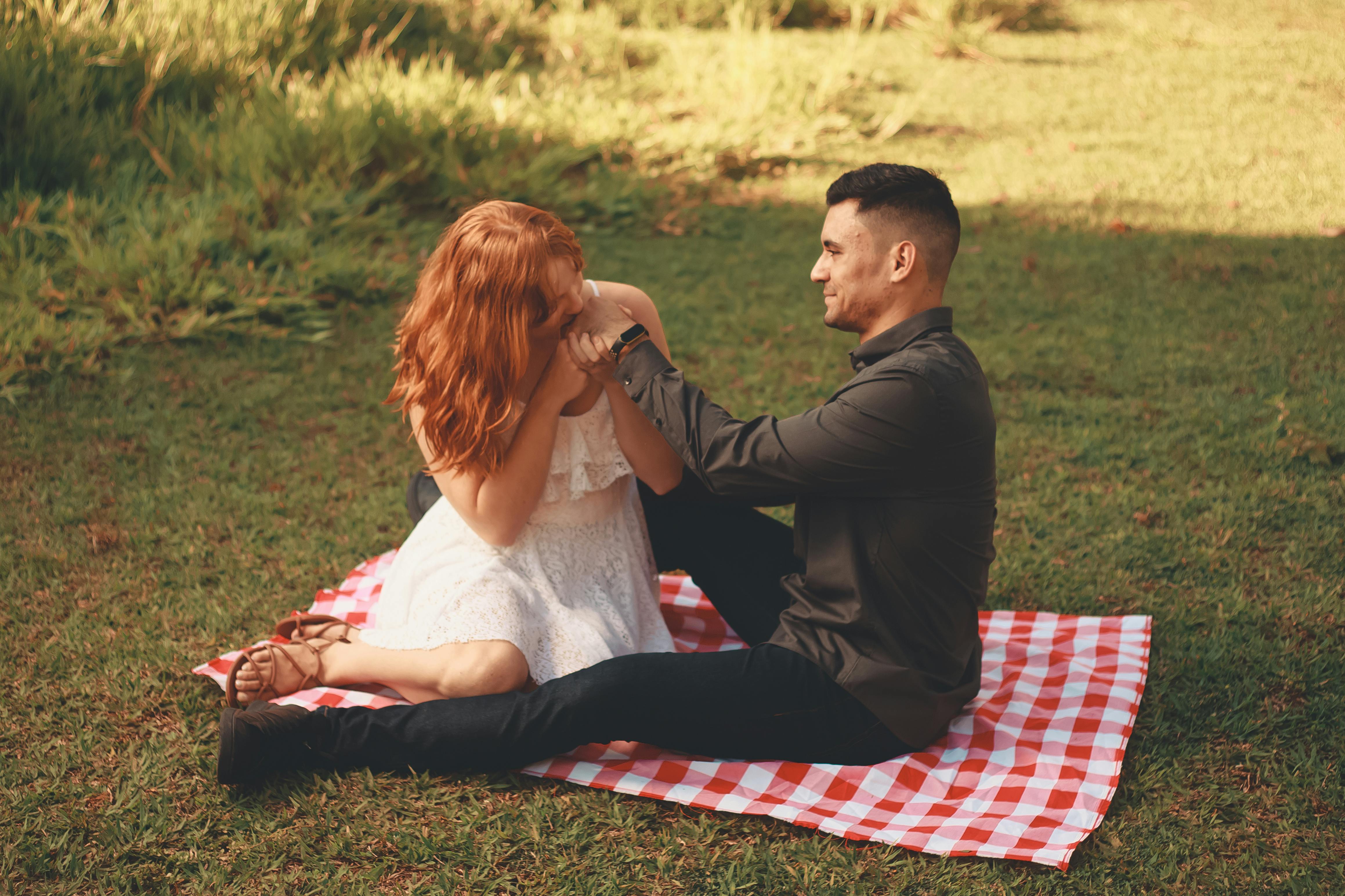 Woman Kissing a Mans Hand · Free Stock Photo