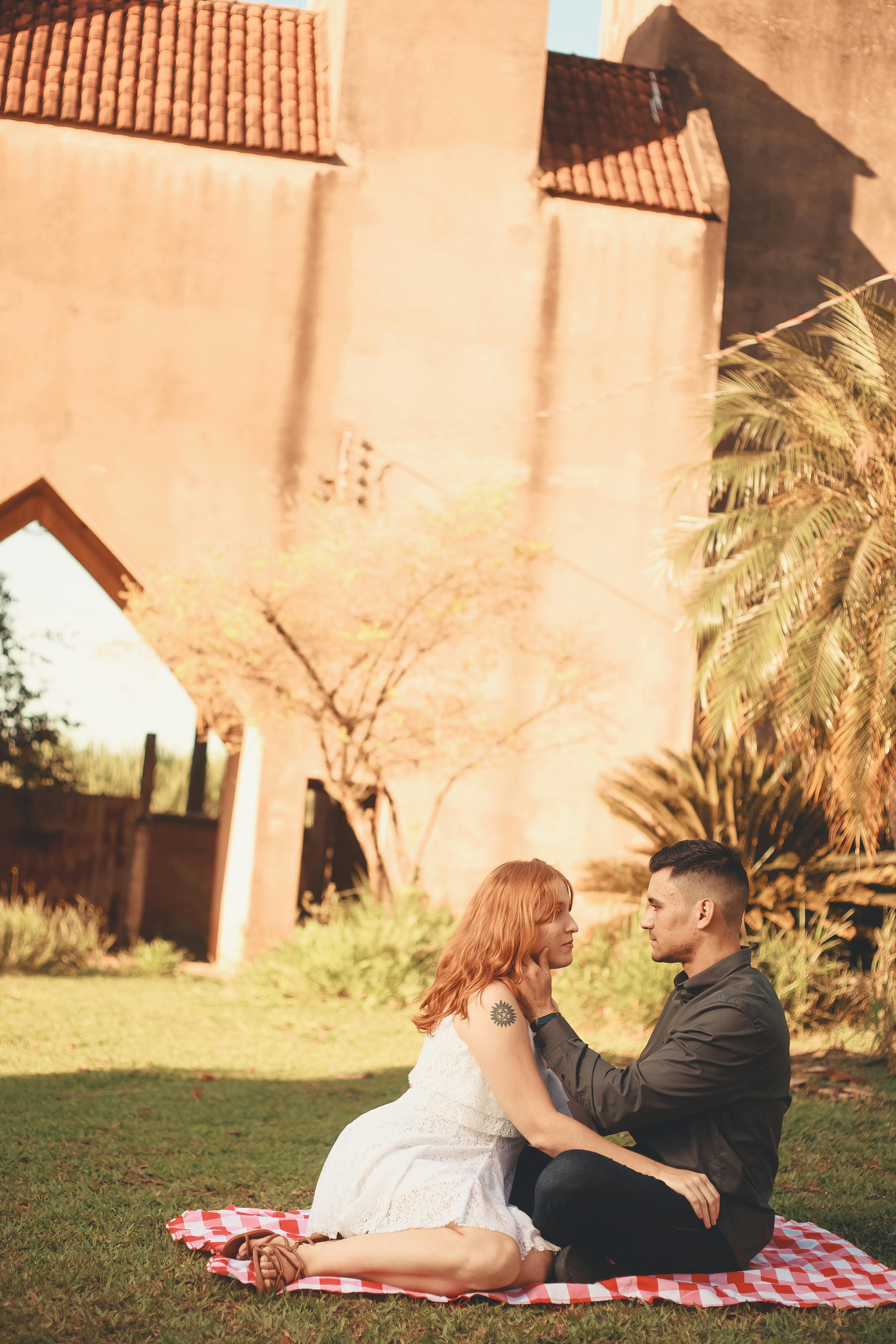 Woman and Man Cuddle on Field · Free Stock Photo
