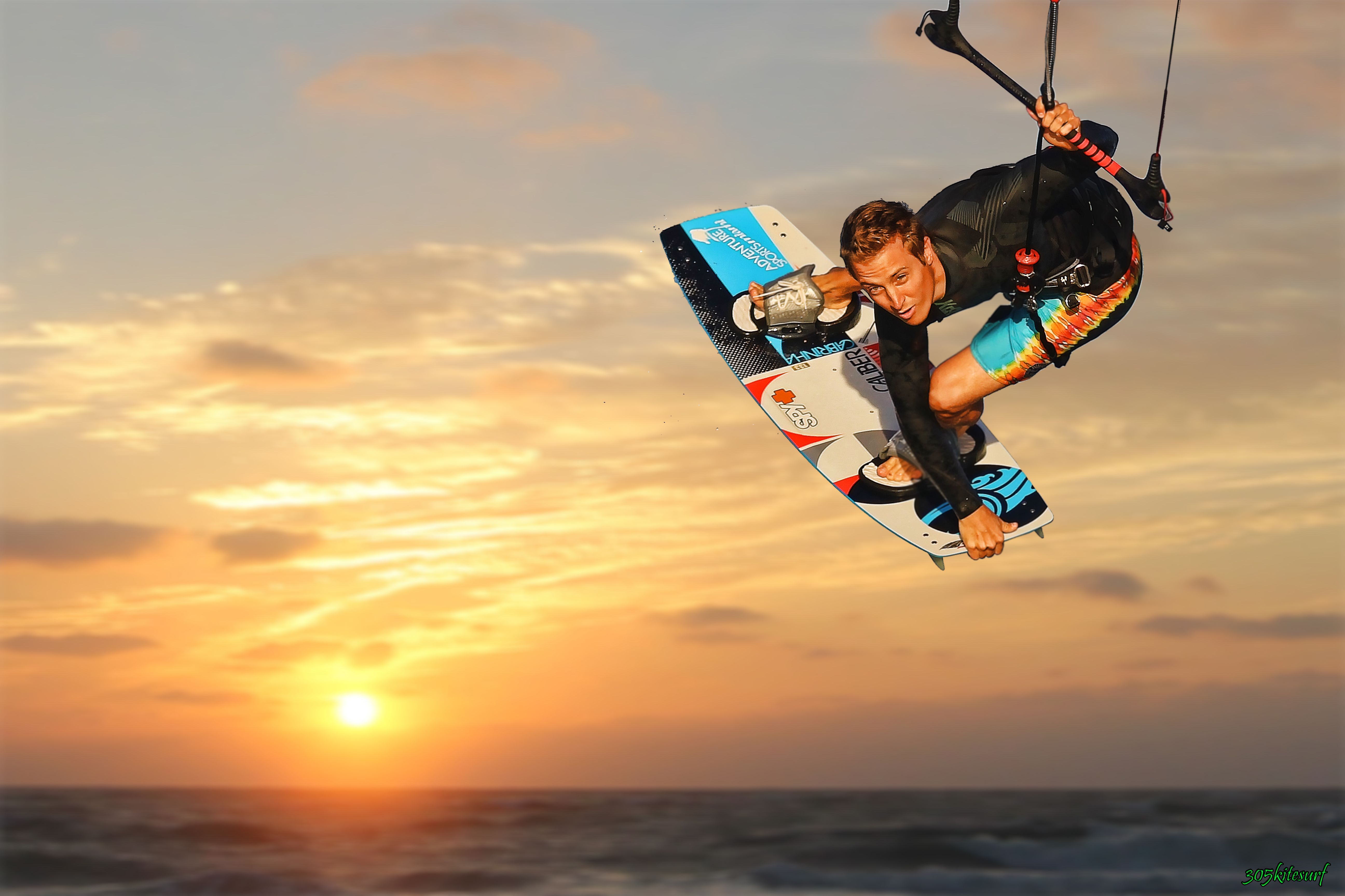 Man Flying above the Sea while Kitesurfing · Free Stock Photo