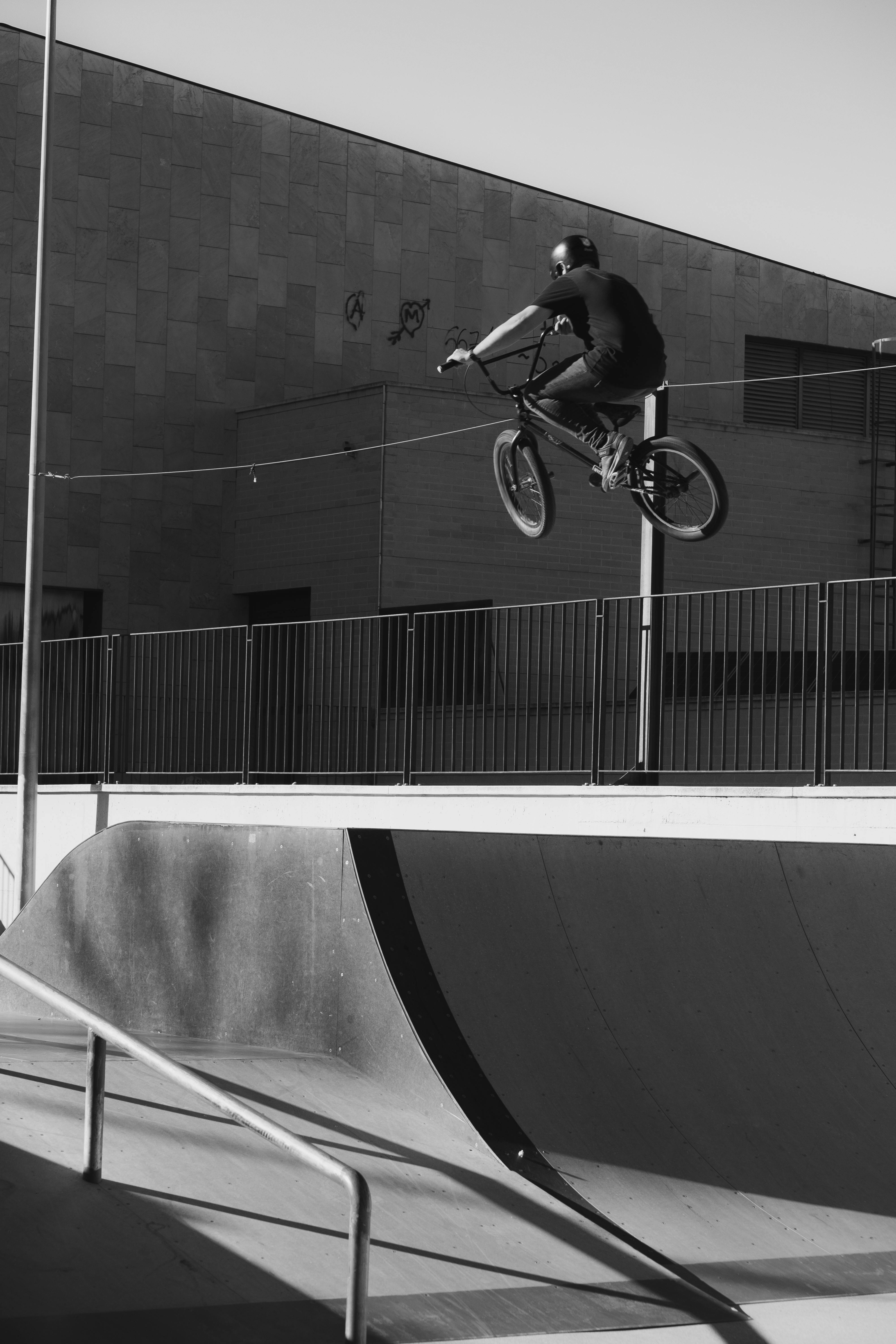 BMX Rider Jumping over Ramp at Skate Park · Free Stock Photo