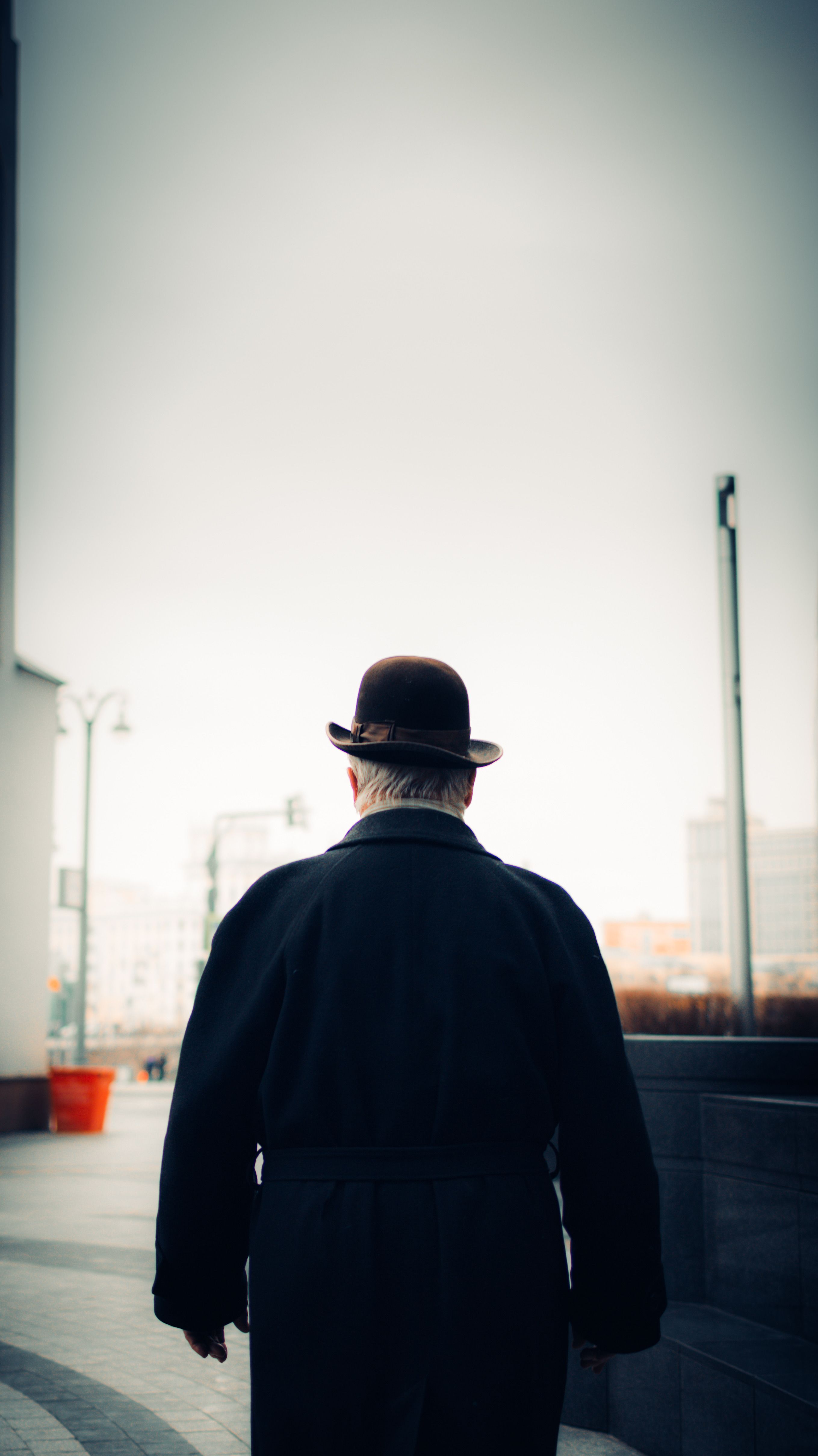 Man in Gray Coat Walking on the Street during Night Time · Free Stock Photo