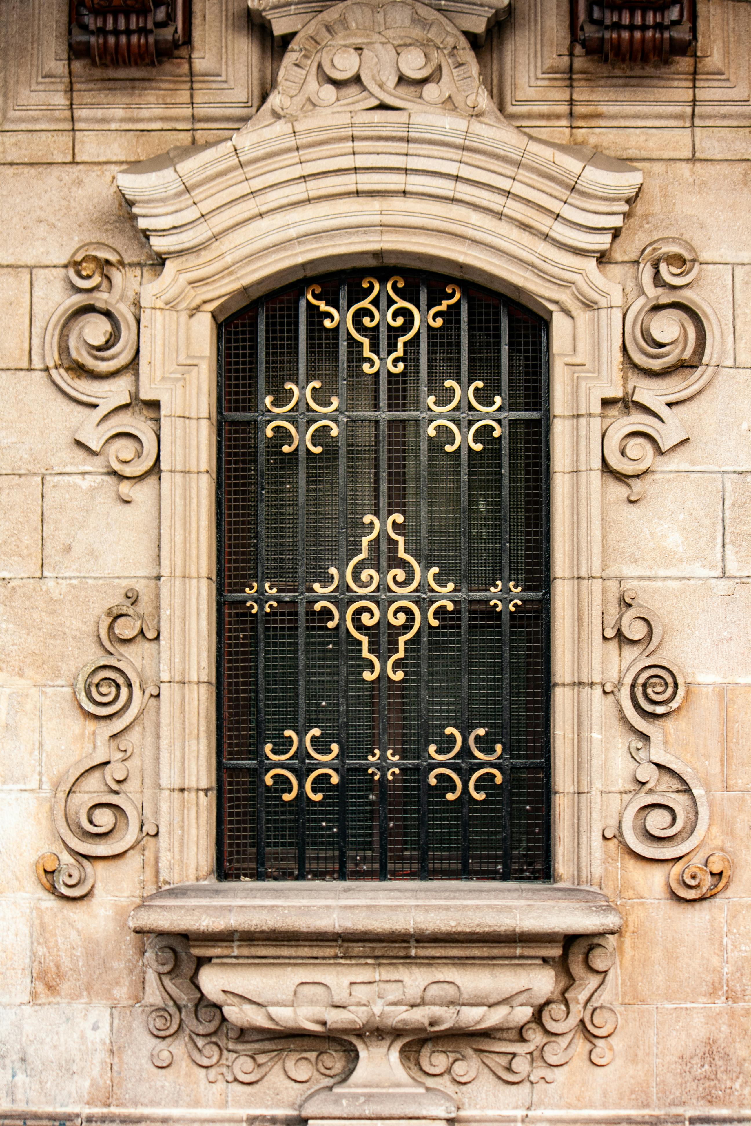 Ornamented Window with Bars · Free Stock Photo