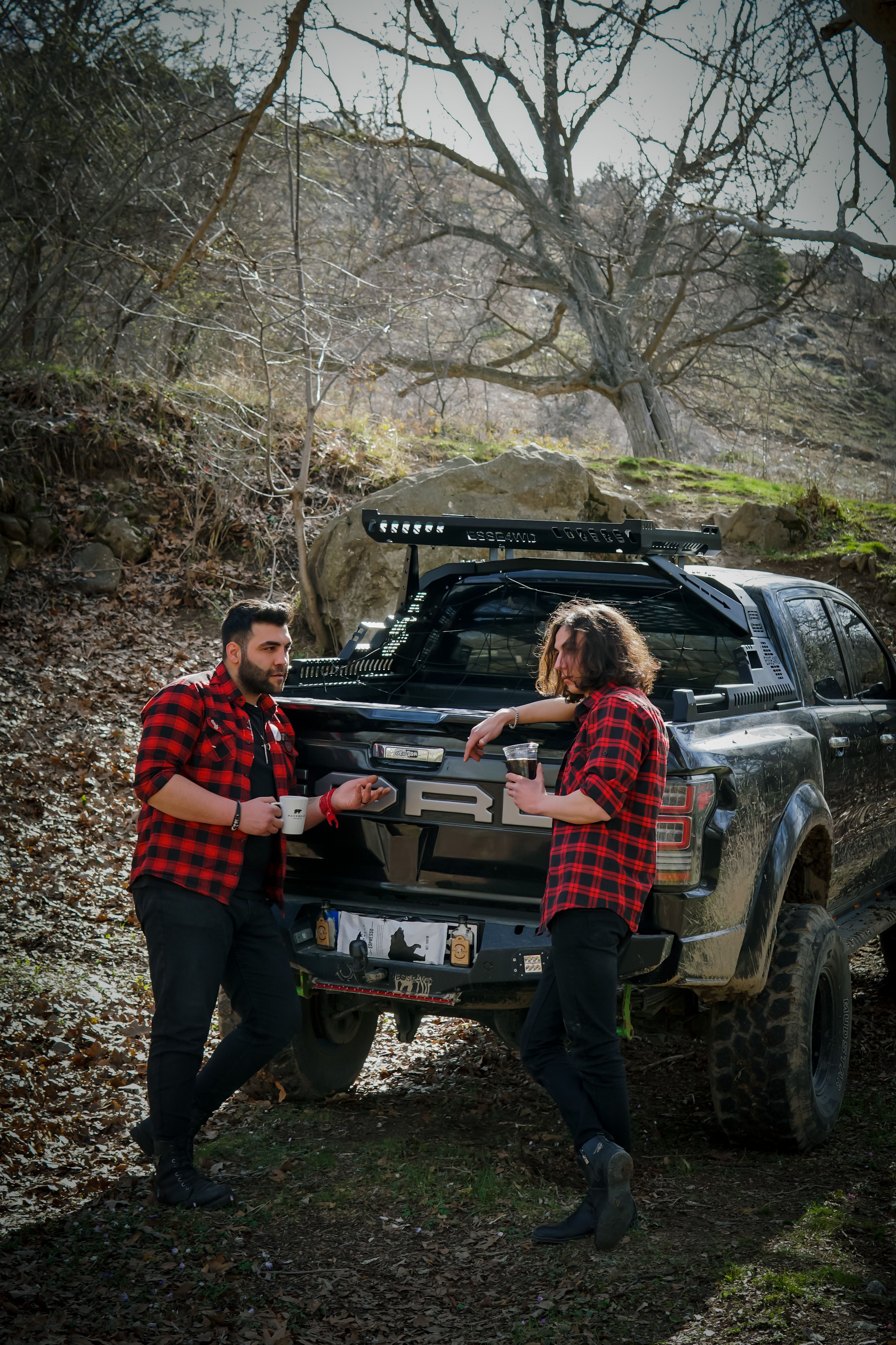 Men Drinking Coffee near Pickup Truck · Free Stock Photo