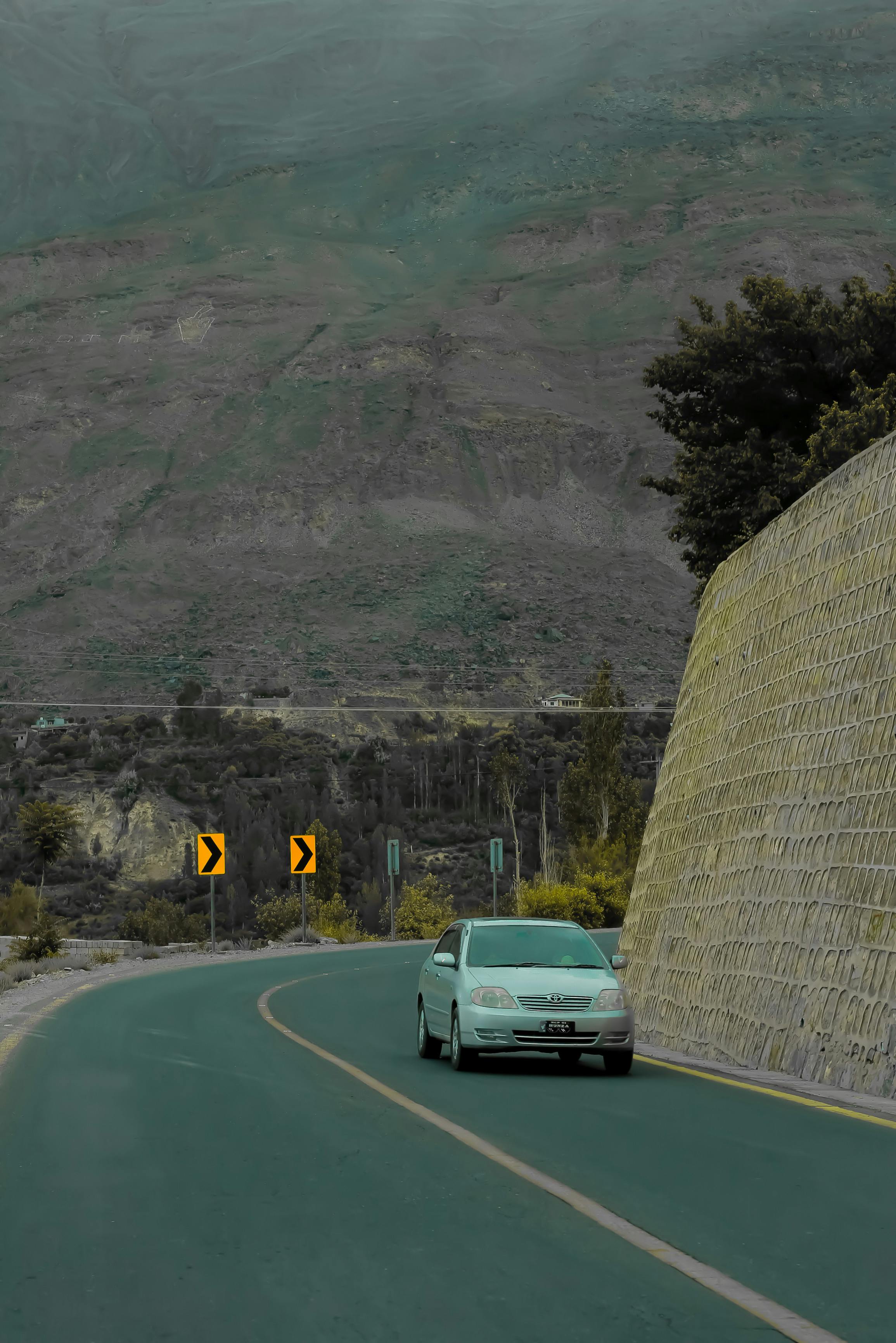 Retro Car Driving in Mountain Landscape on Sunset · Free Stock Photo