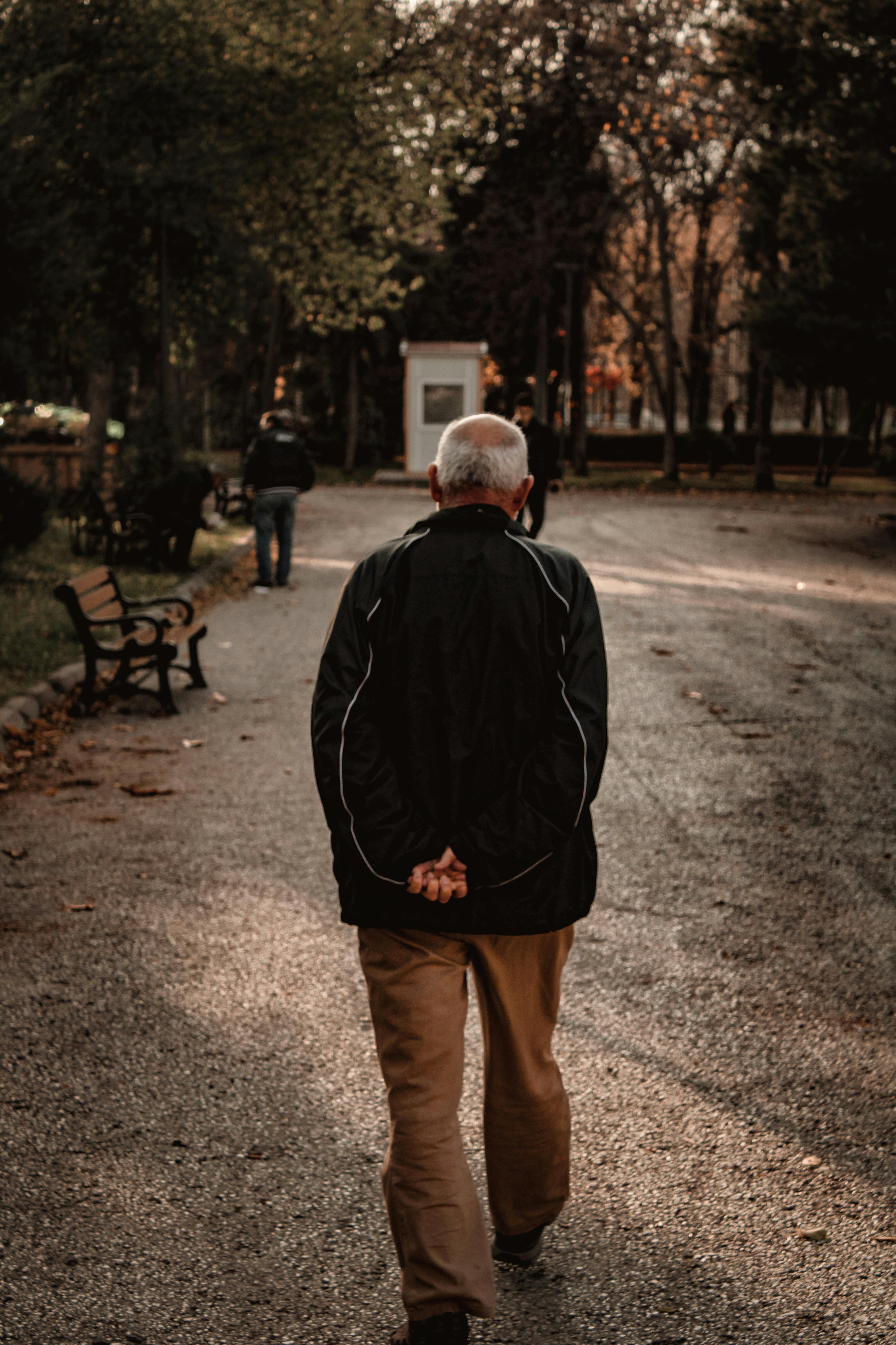 Elderly Man Walking in a Park · Free Stock Photo