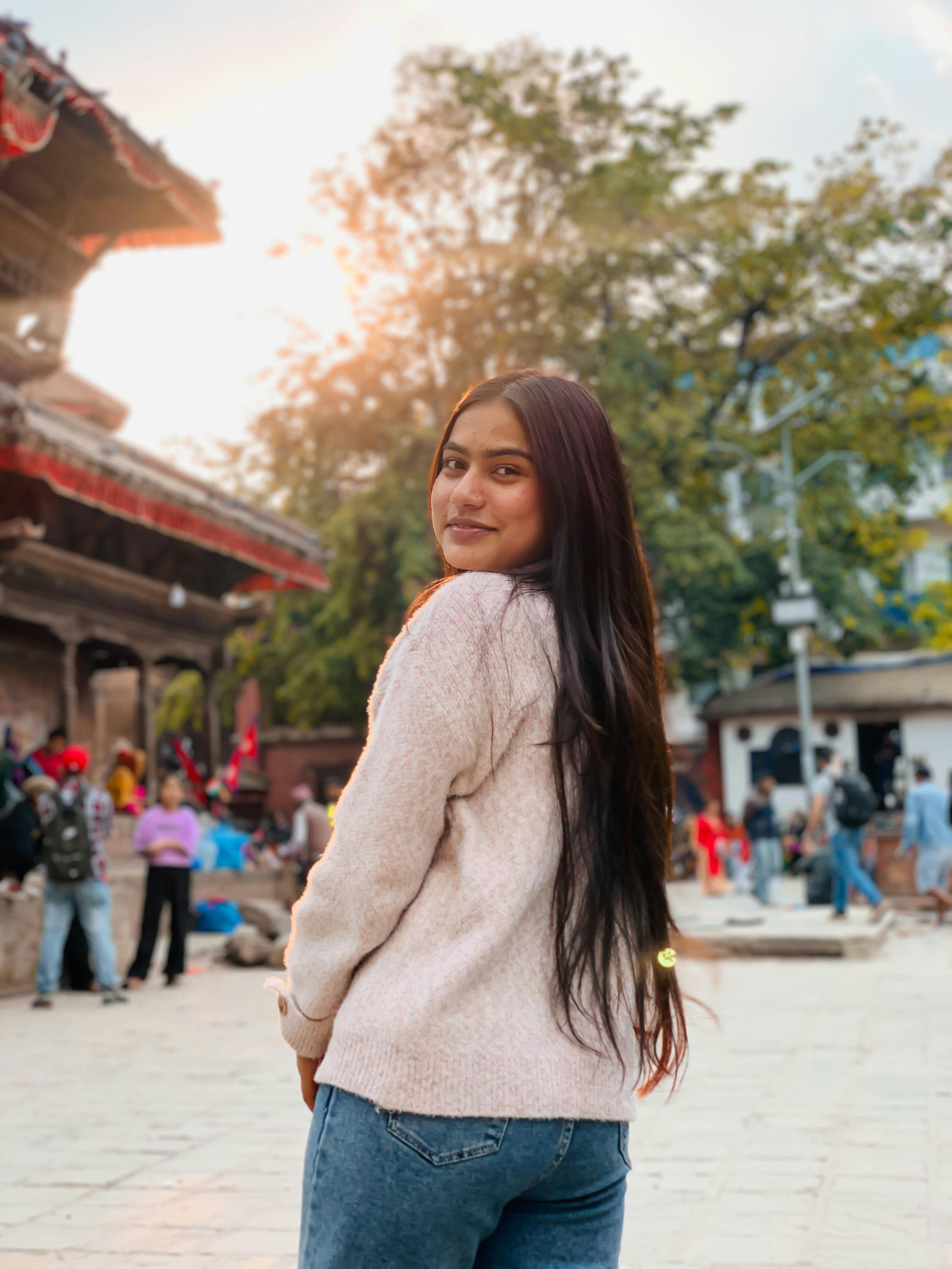 Brunette Woman Posing with Sunlight behind · Free Stock Photo