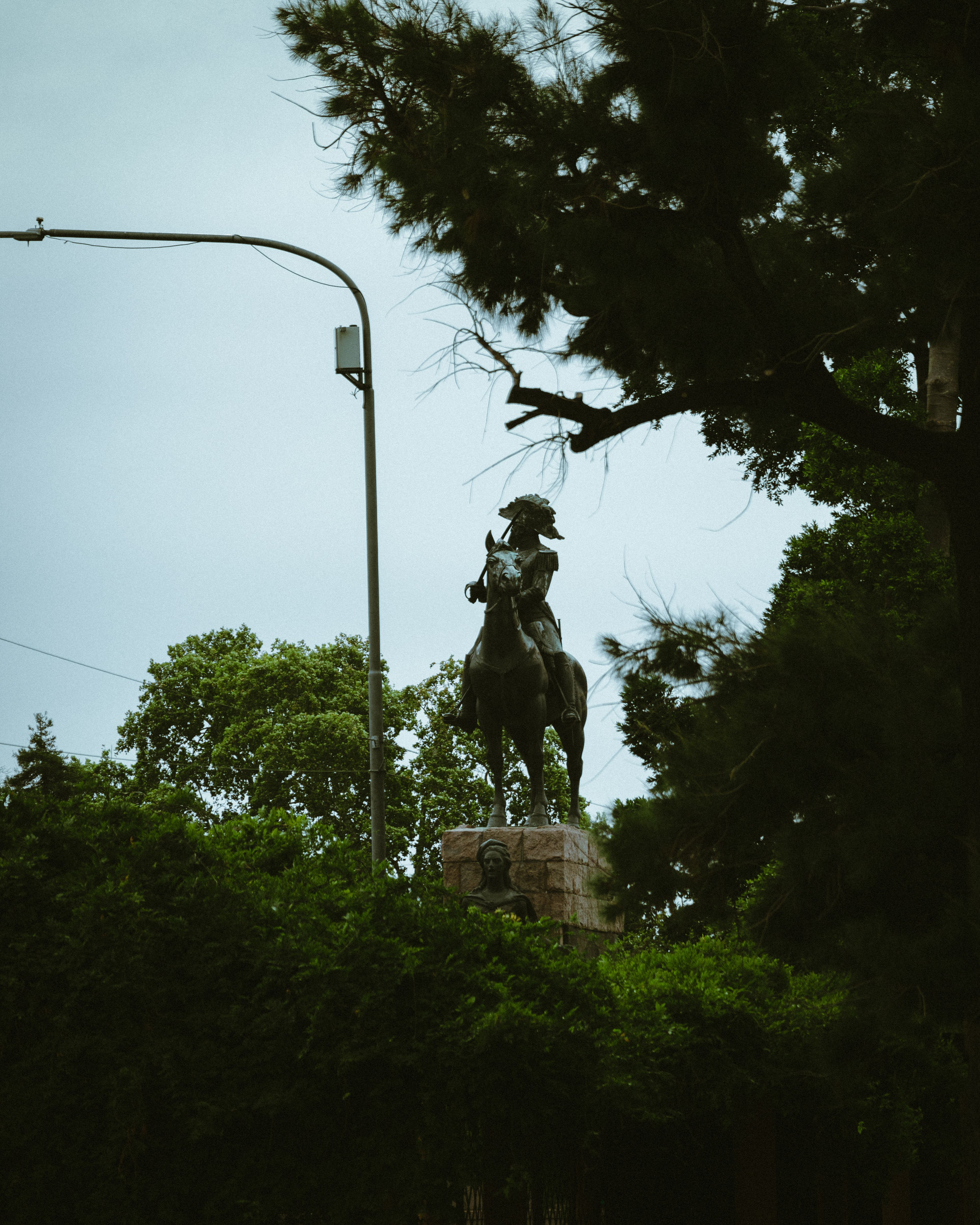 View of an Equestrian Statue between Trees in a Park · Free Stock Photo