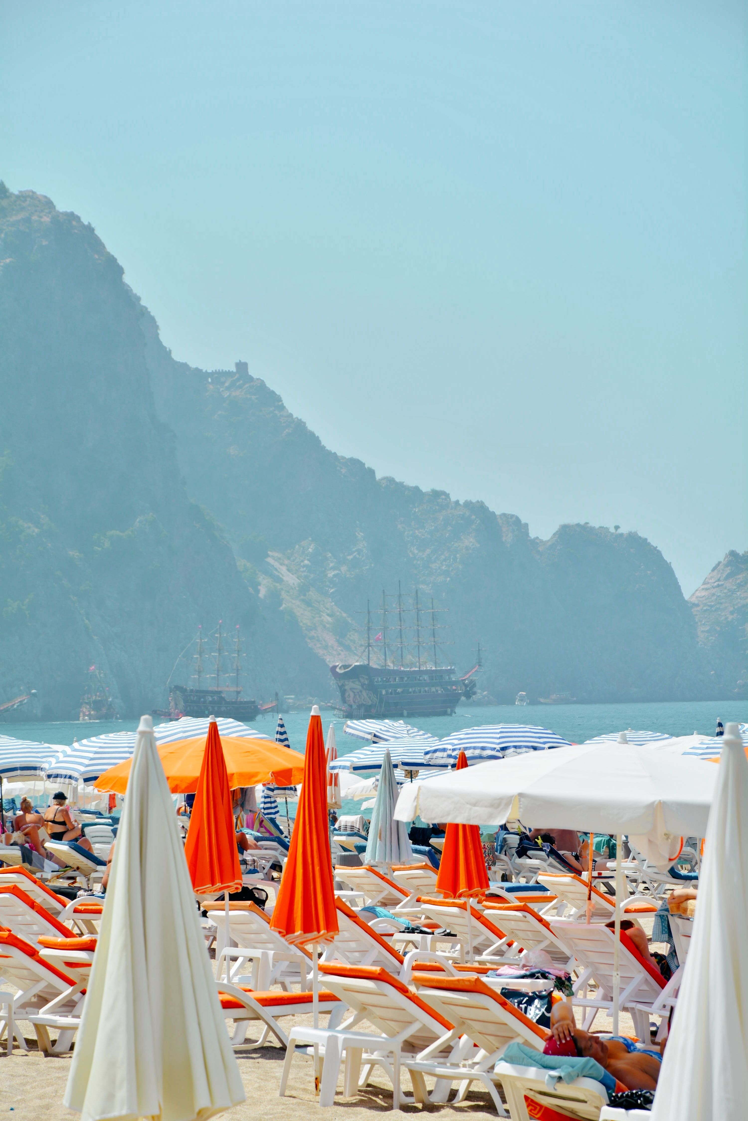 People Sunbathing on the Beach · Free Stock Photo