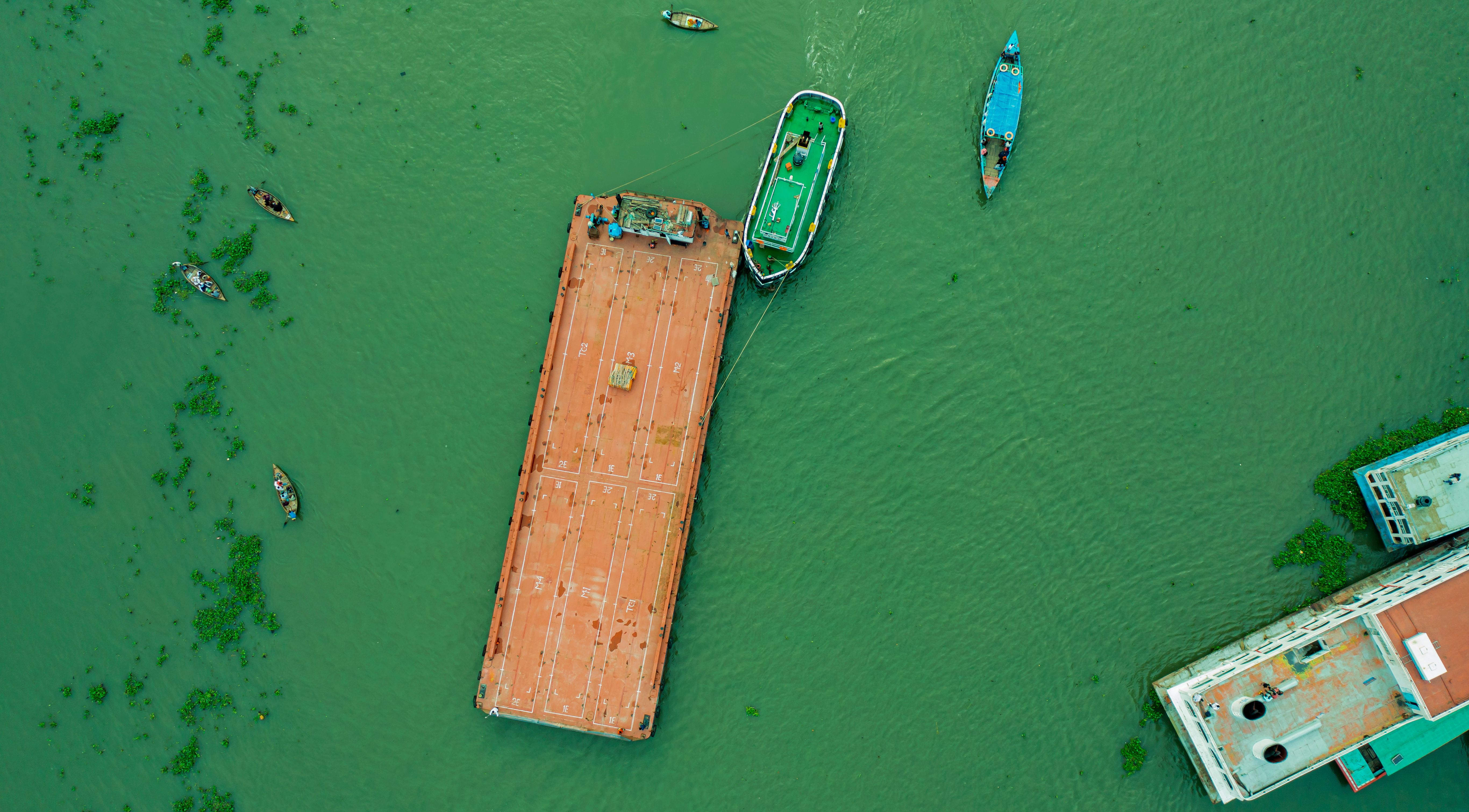 Aerial View of a Cargo Barge Towed by a Tugboat on the Green River ...