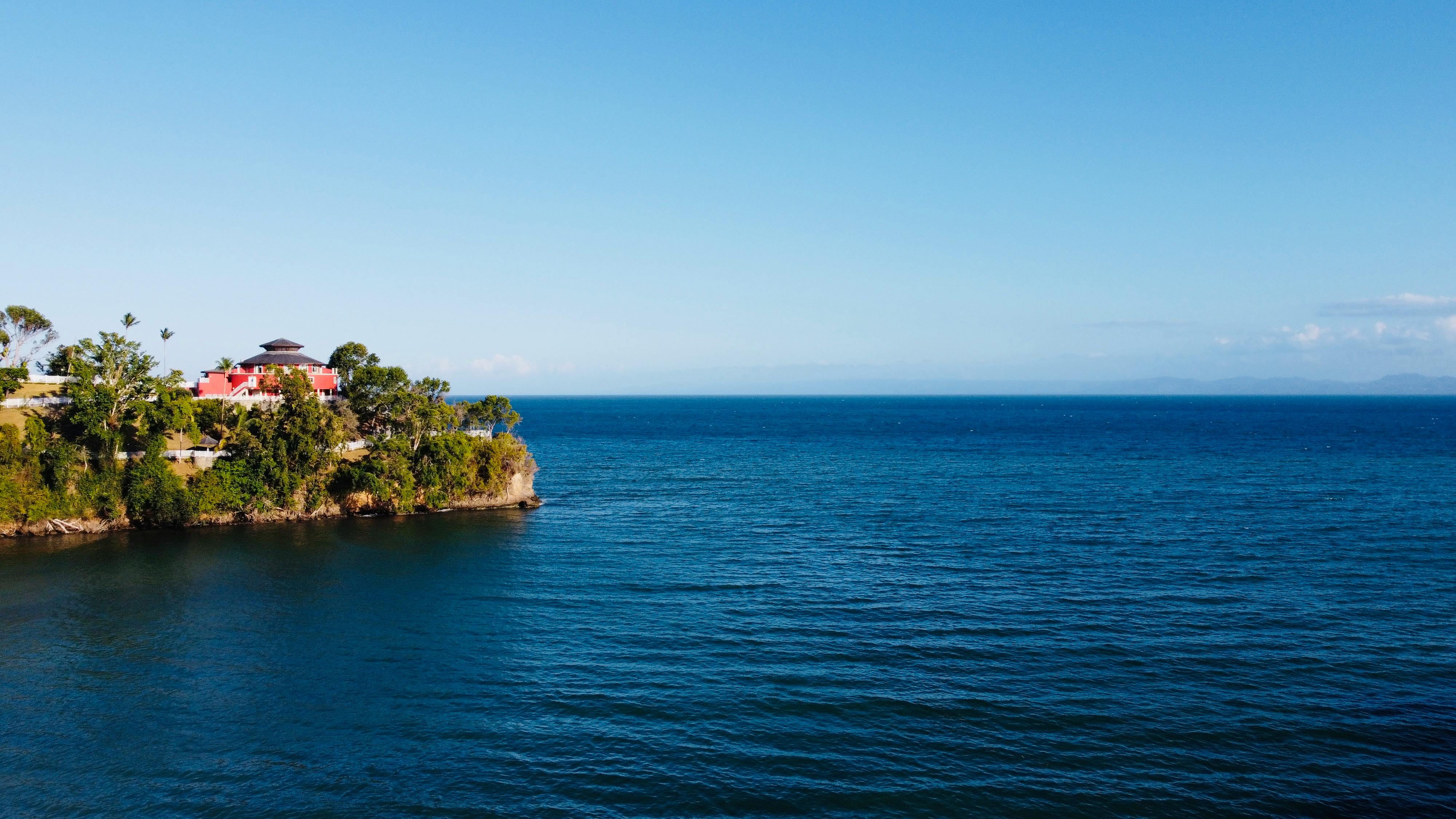 House on a Peninsula Surrounded by the Sea · Free Stock Photo