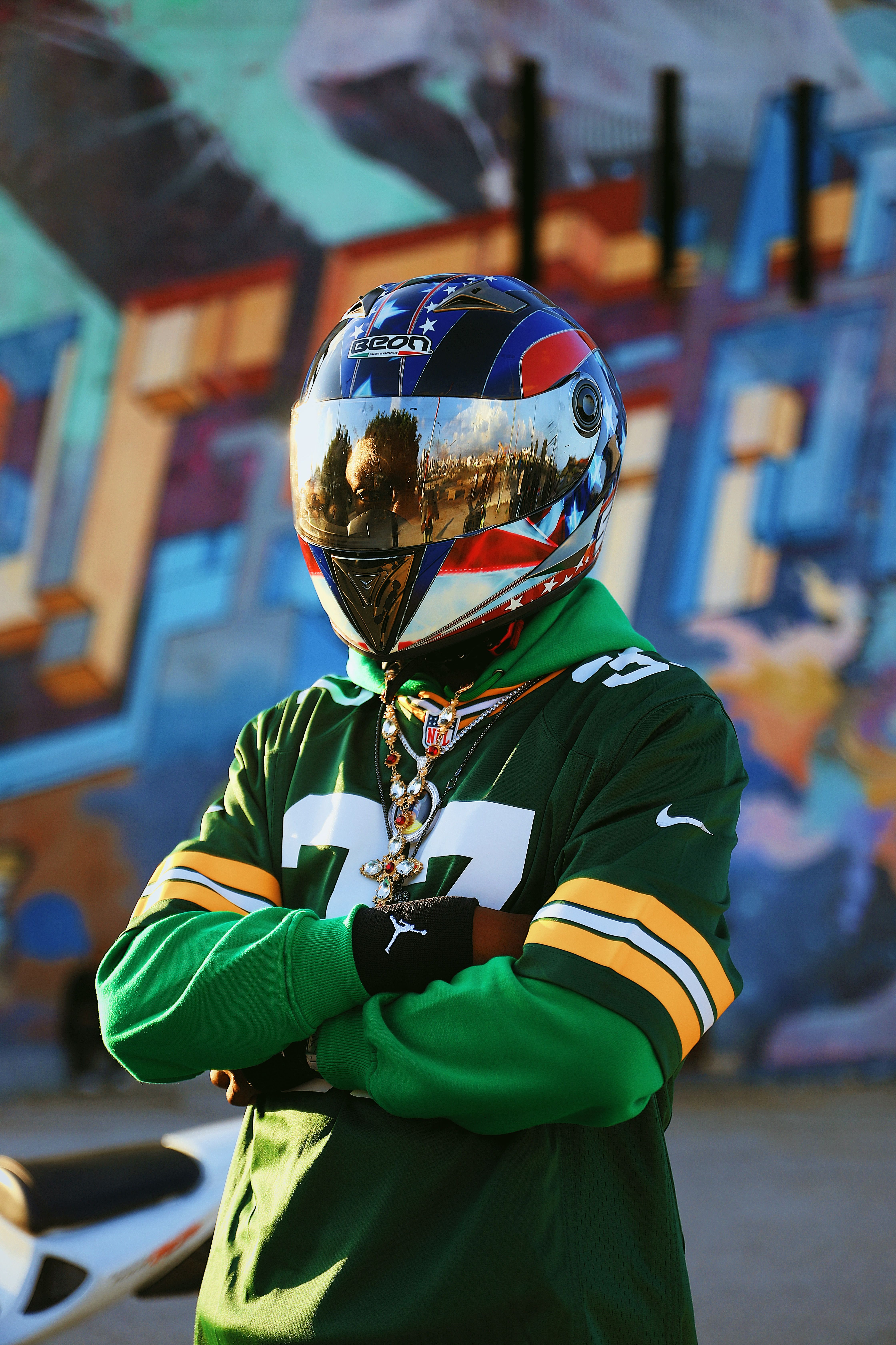 Man with Crossed Arms Wearing Bicycle Helmet · Free Stock Photo