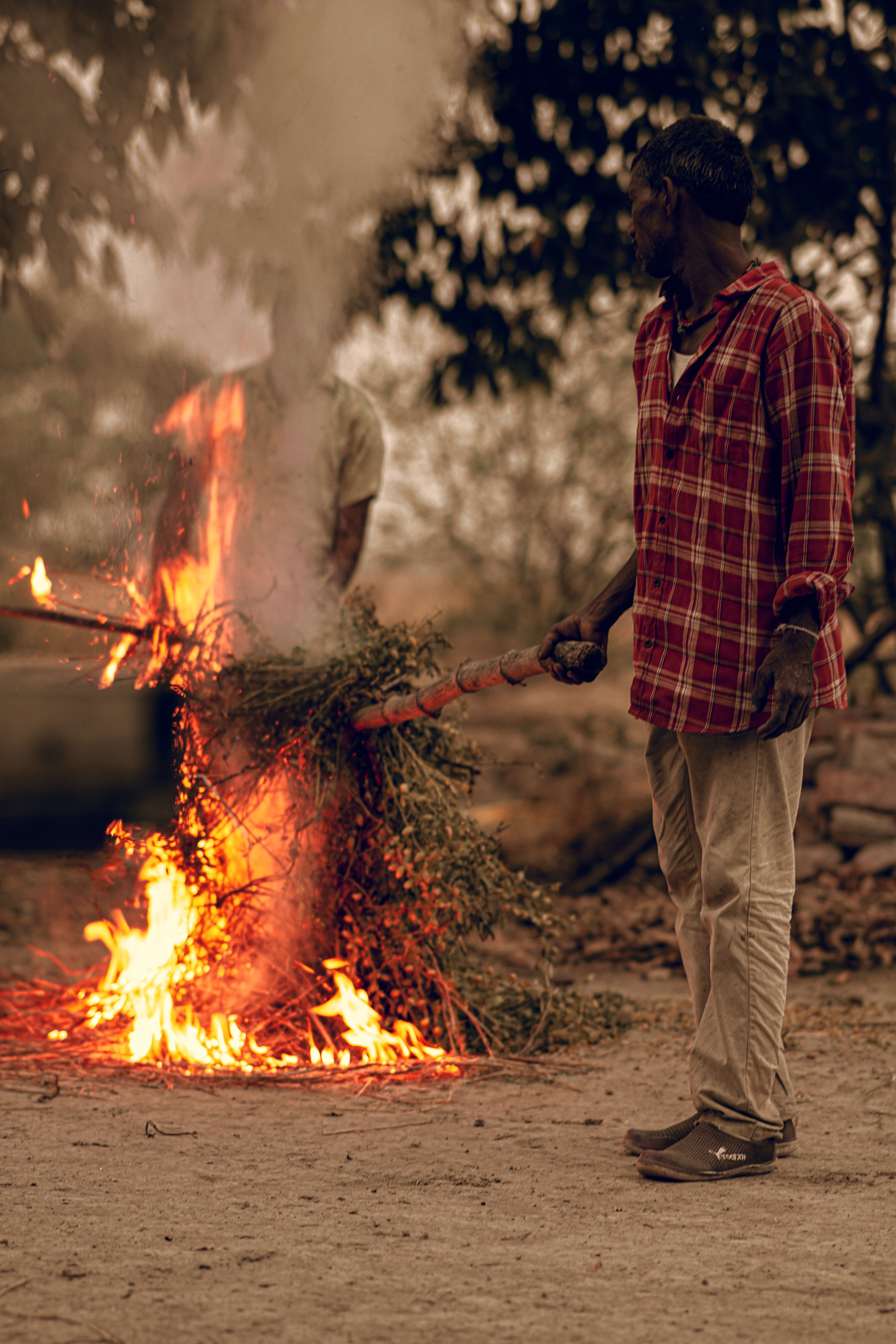 Man Standing near Fire at Night · Free Stock Photo