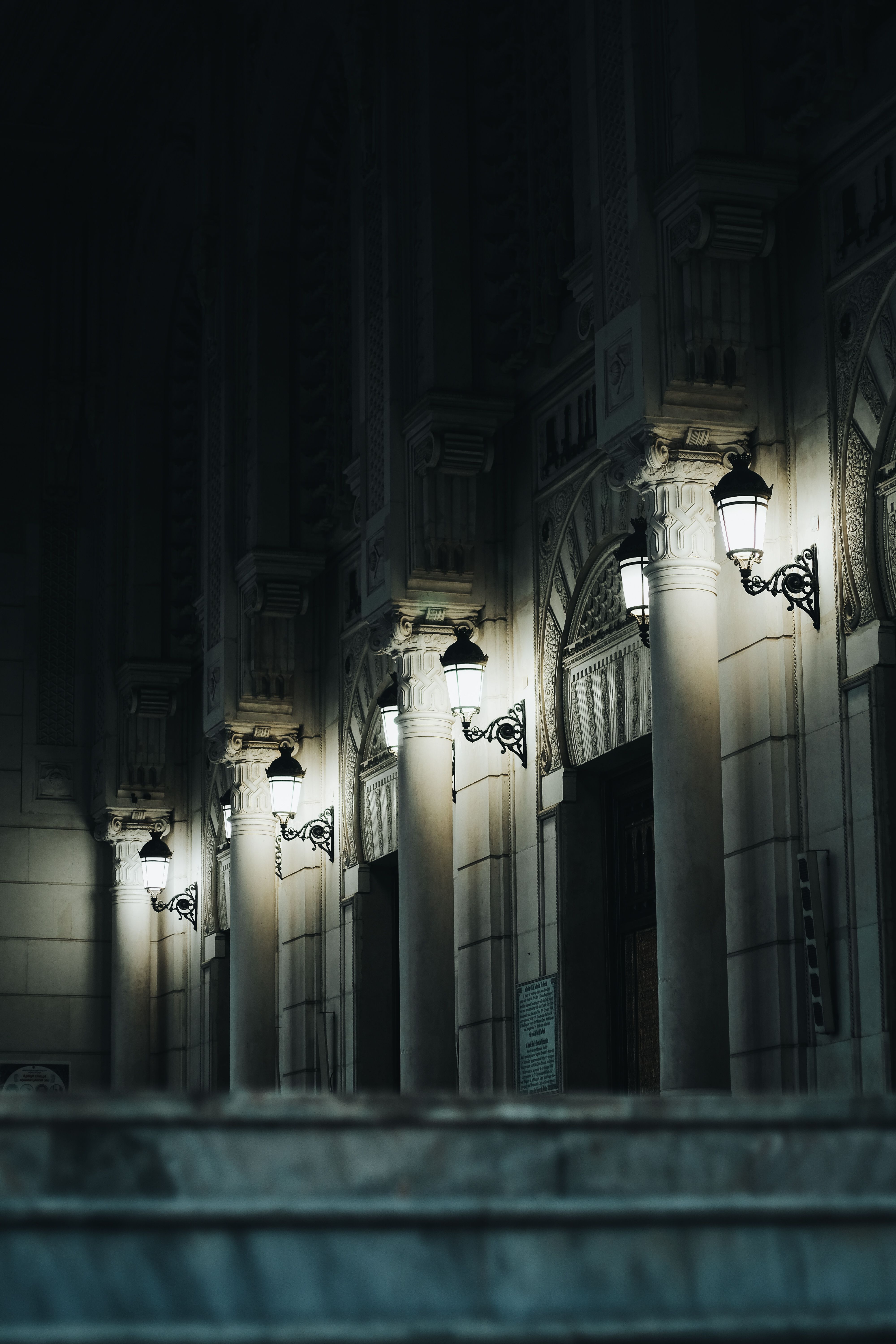 Lights over Building Columns at Night · Free Stock Photo