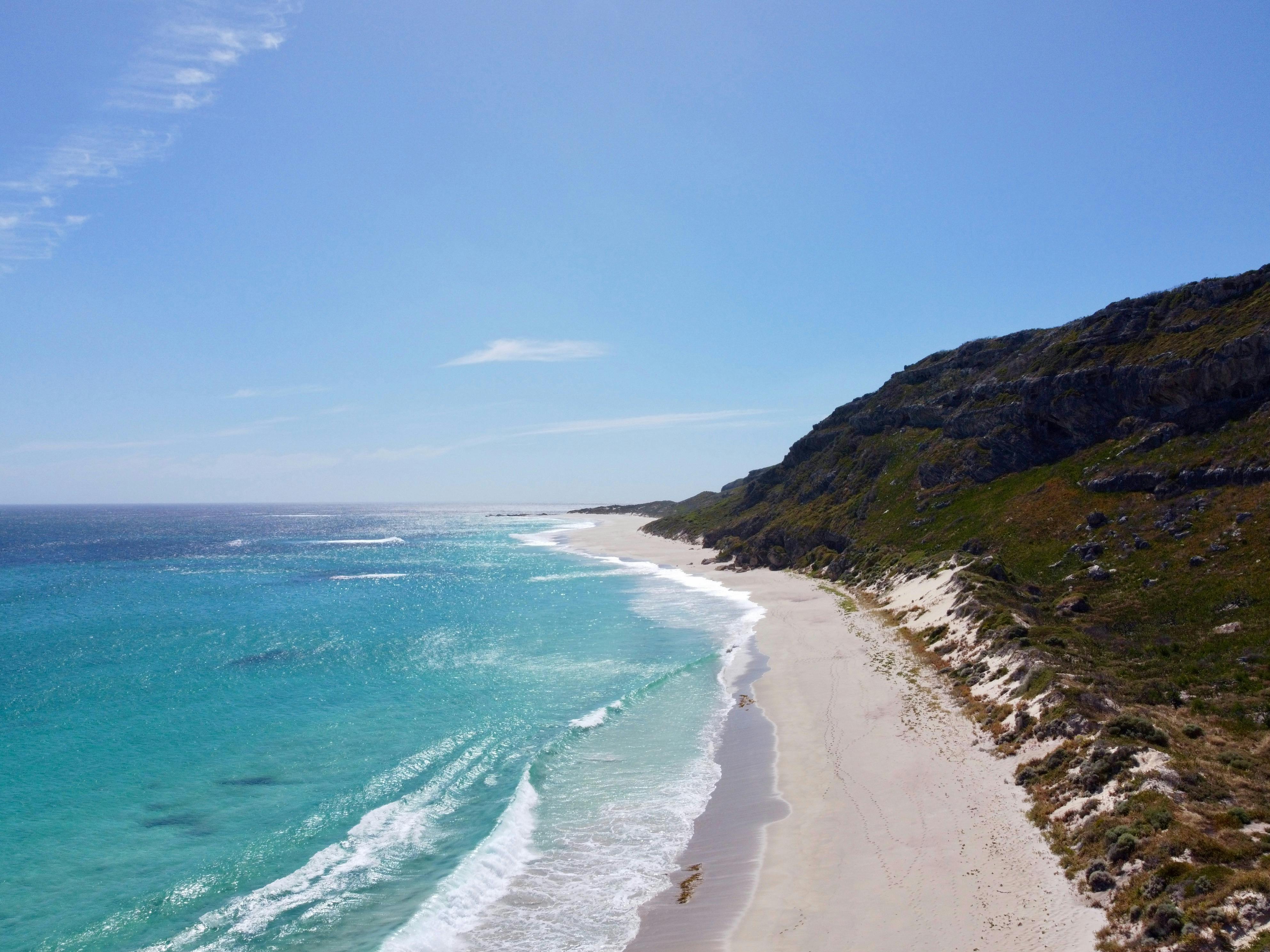 Waves on a Sunny Beach · Free Stock Photo