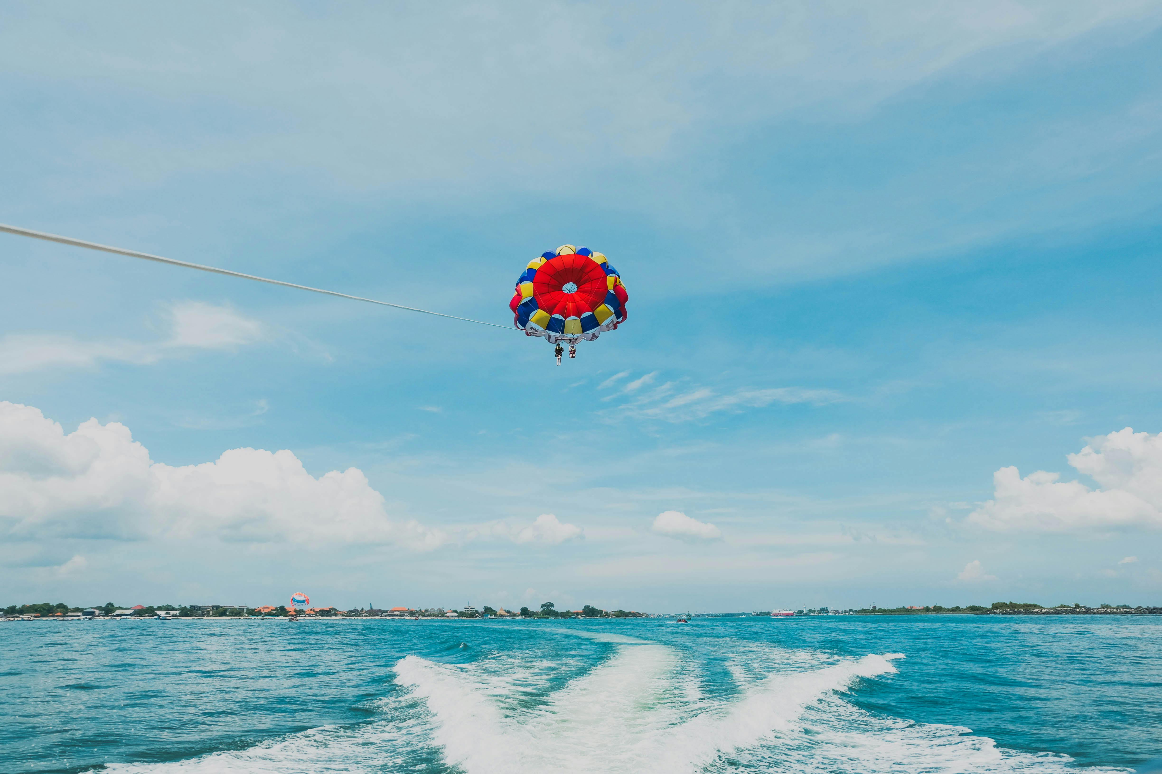 People Parasailing with Parachute in Bali, Indonesia · Free Stock Photo
