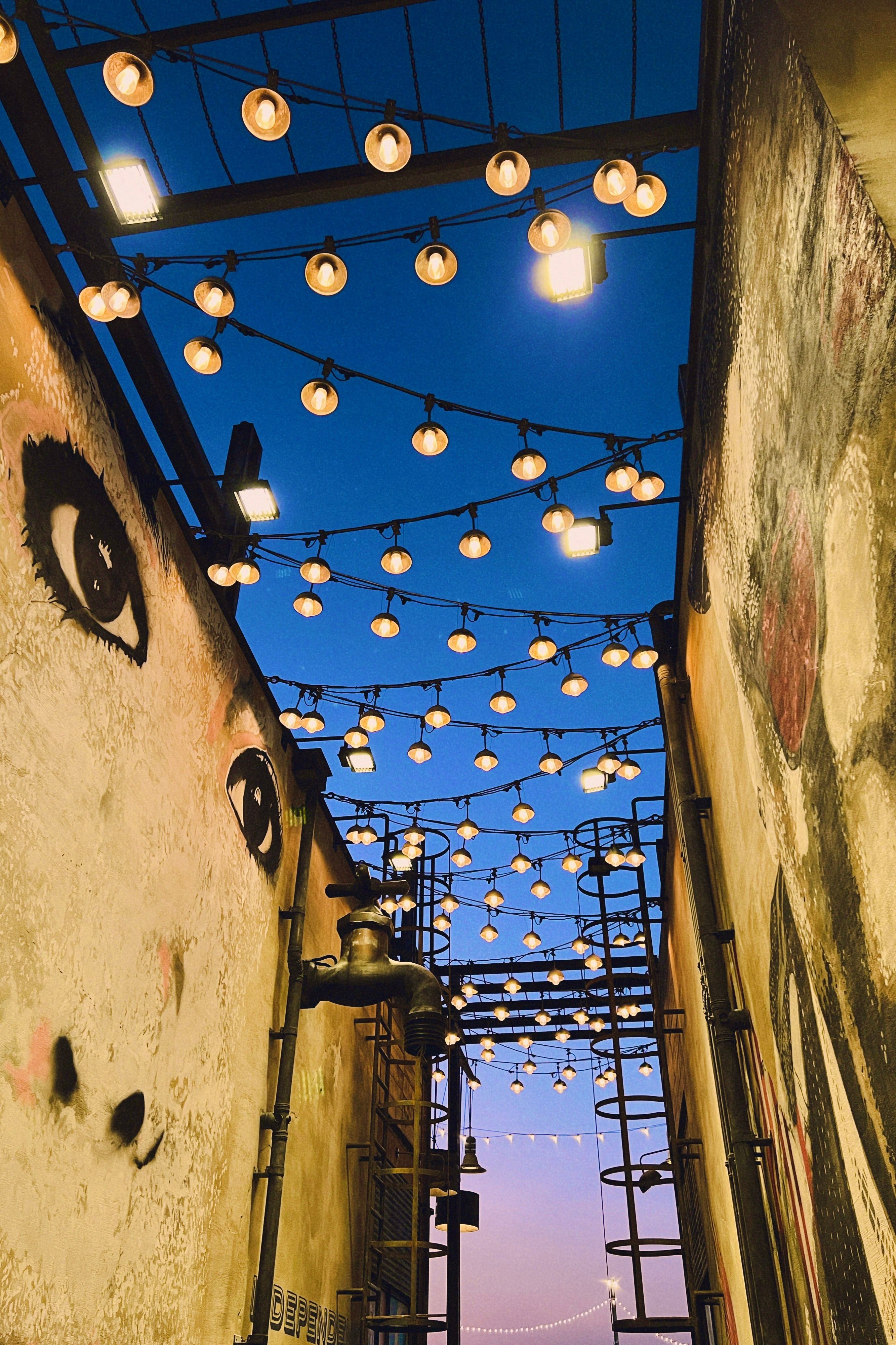 Lamps between Walls with Murals · Free Stock Photo