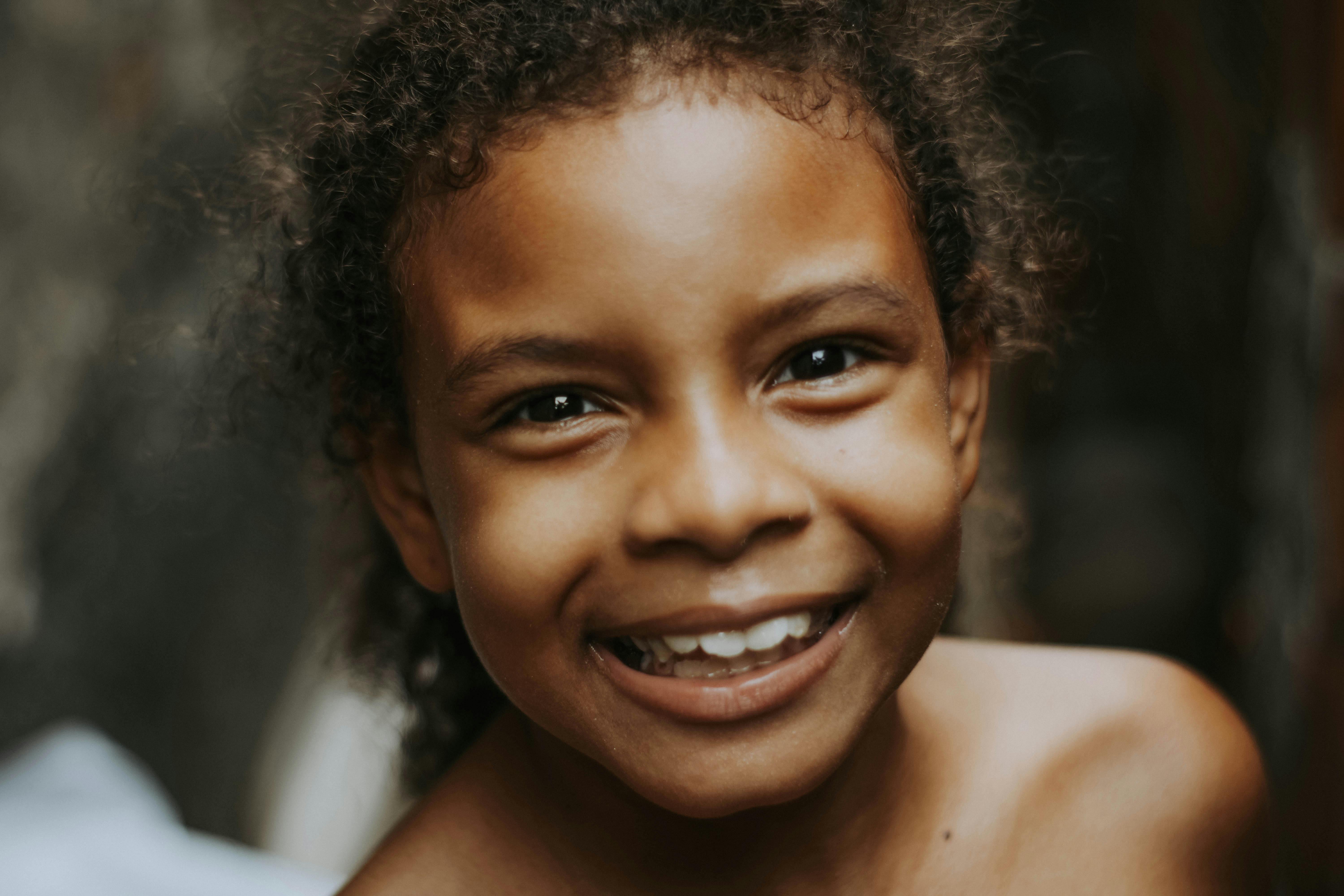 Joyful Child Smiling Outdoors · Free Stock Photo