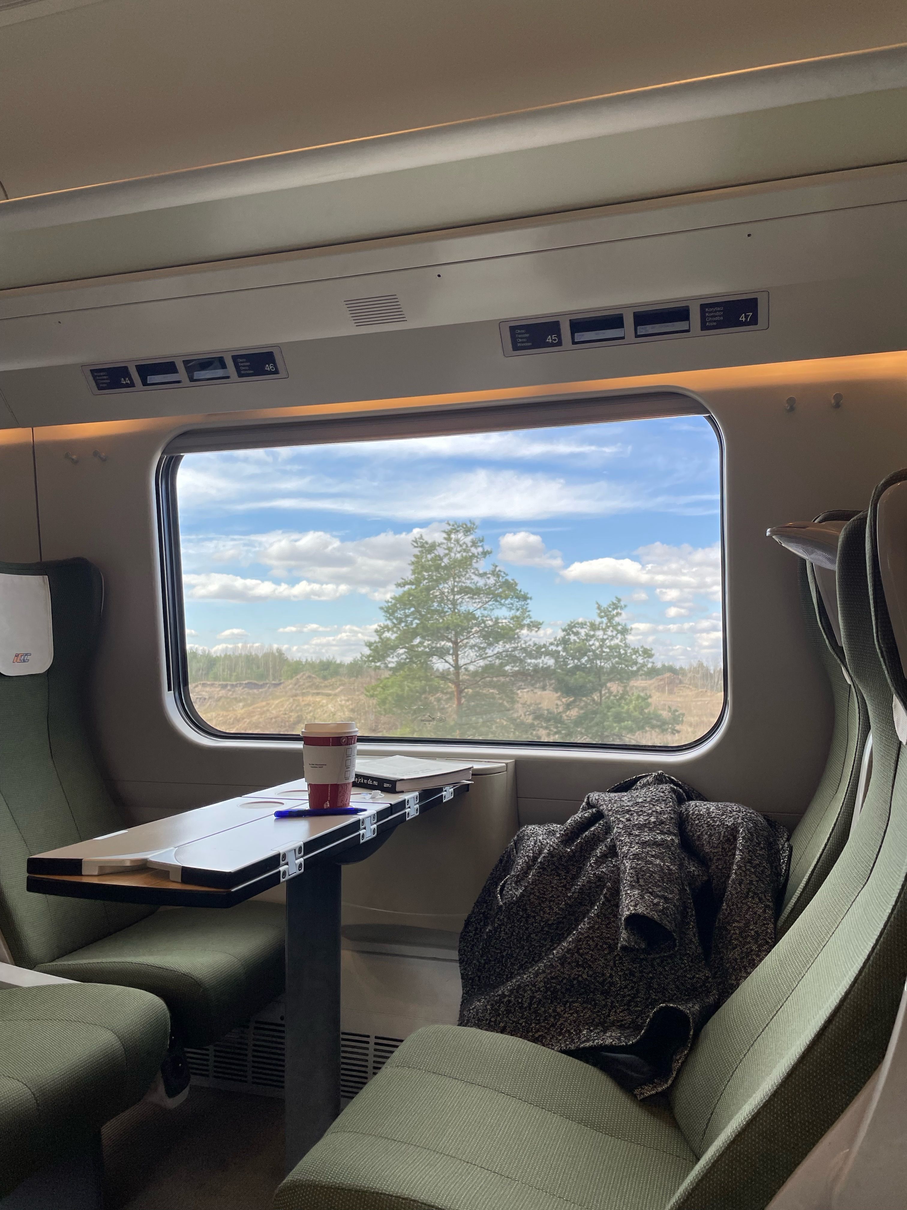 Trees and Clouds behind Train Window · Free Stock Photo