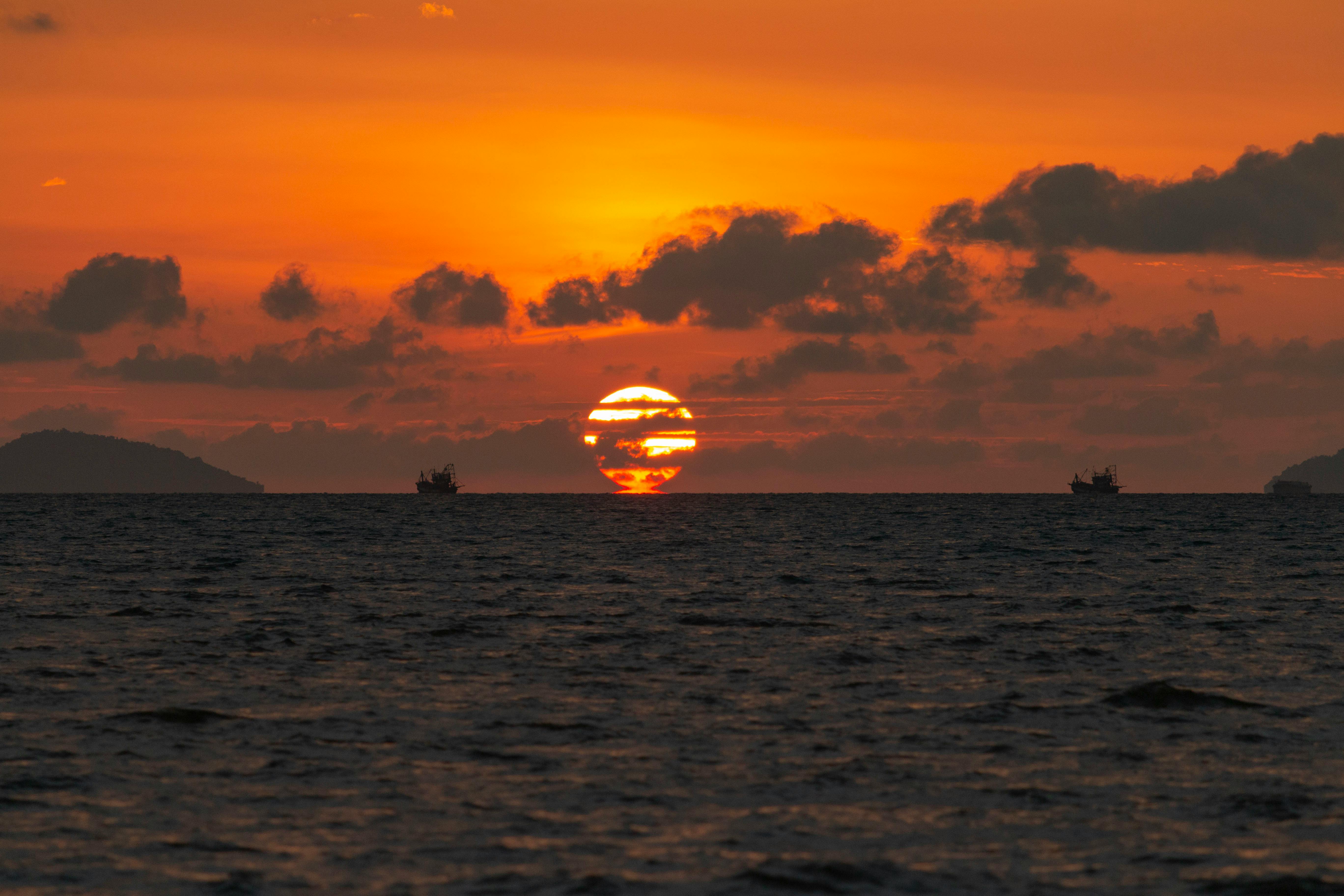 Boats on Calm Sea at Sunset · Free Stock Photo