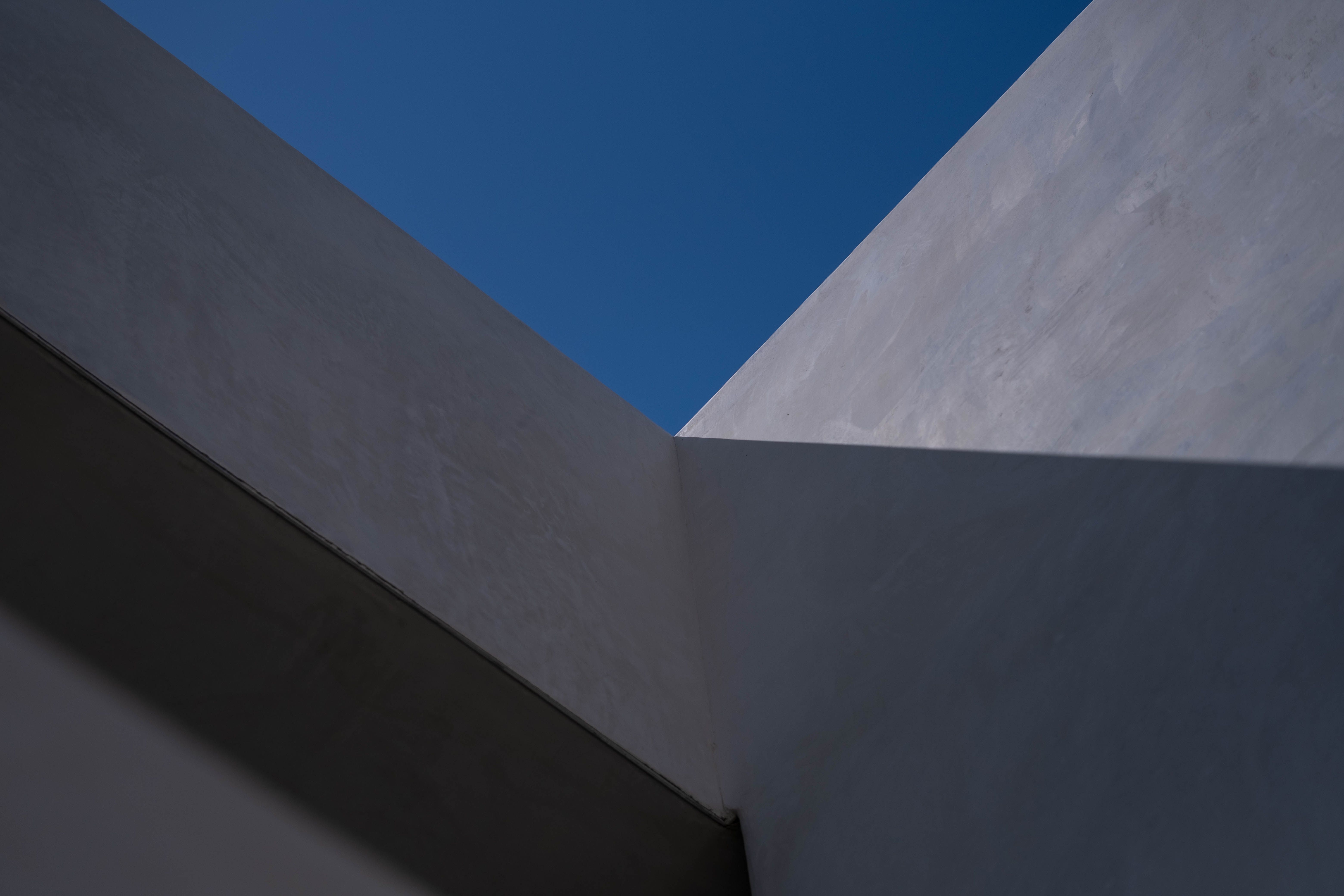 Low Angle Shot of a Concrete Wall on the Background of Blue Sky · Free ...