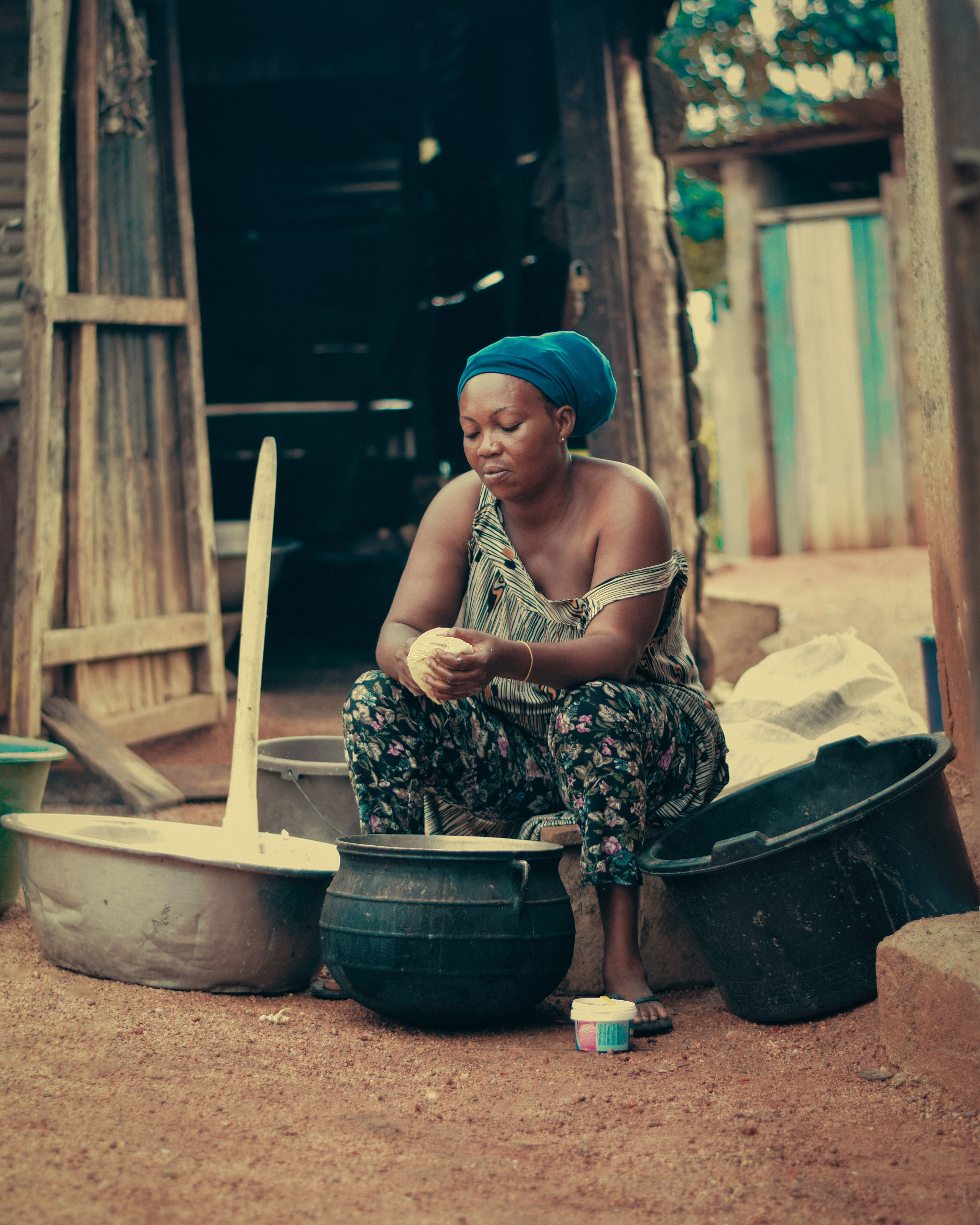 African Woman Cooking in Traditional Outdoor Kitchen · Free Stock Photo