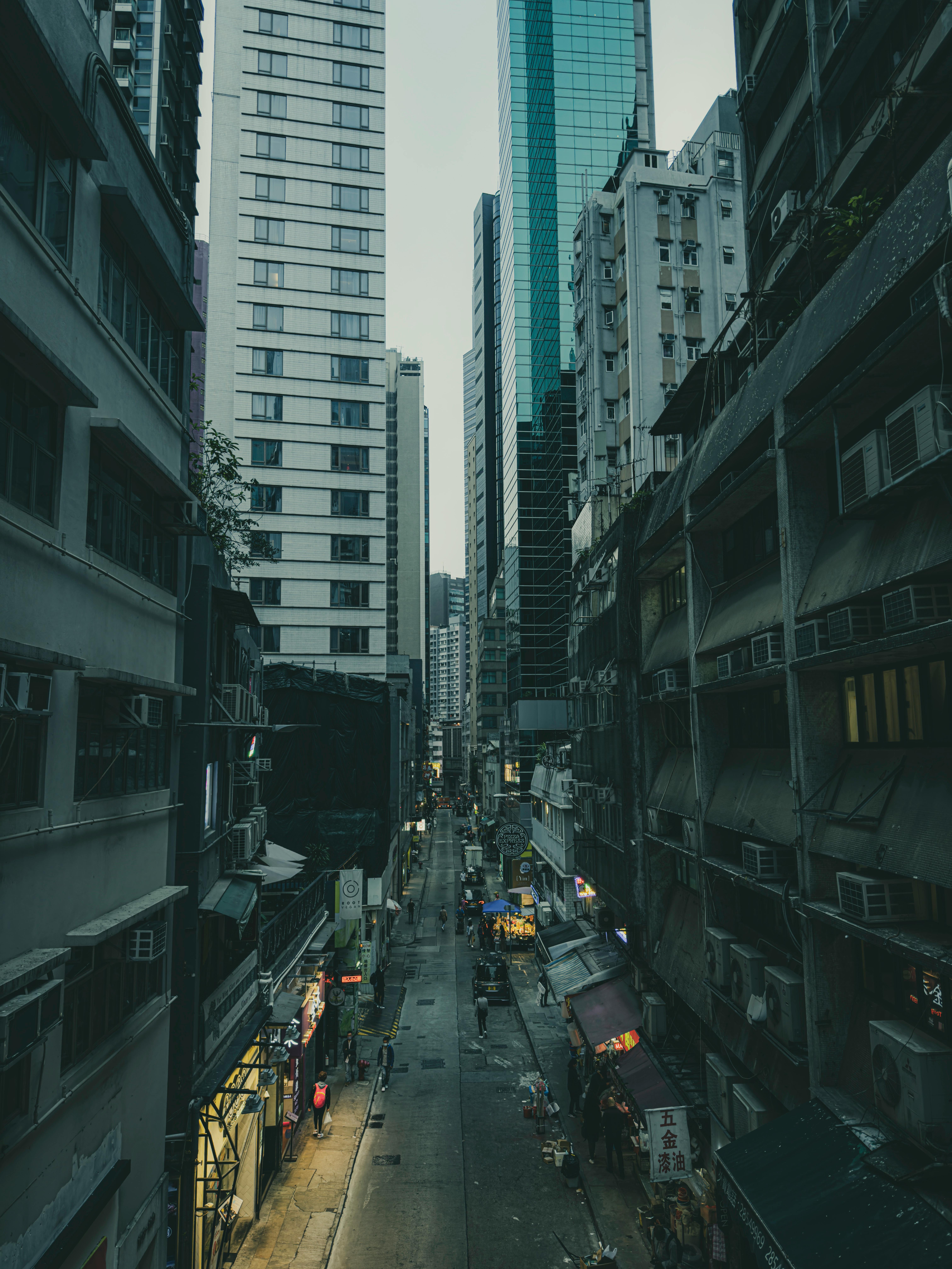 Dark Gray Alley at the Foot of Modern Skyscrapers · Free Stock Photo