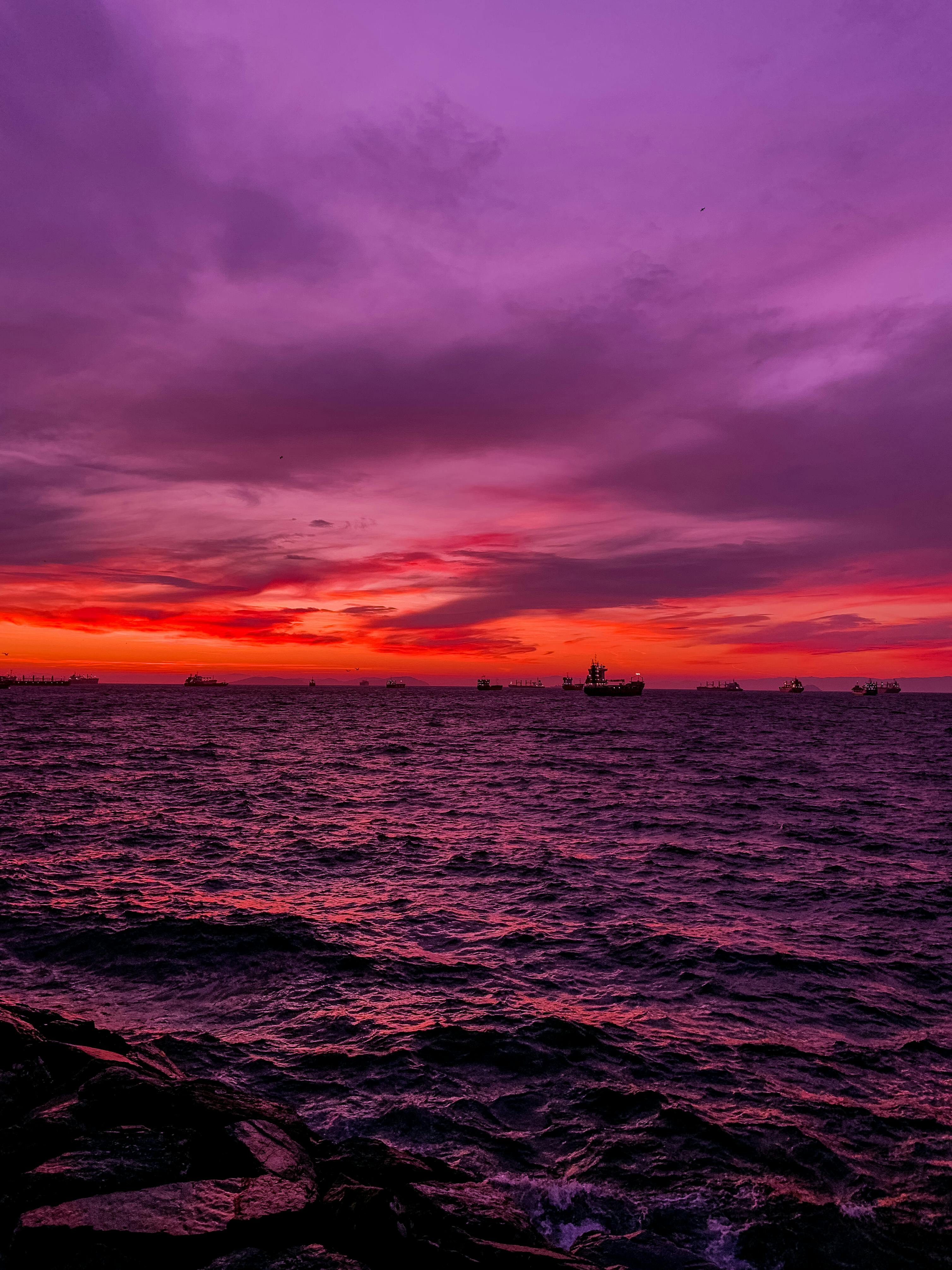 Red and Violet Sky over a Bay Full of Cargo Ships · Free Stock Photo