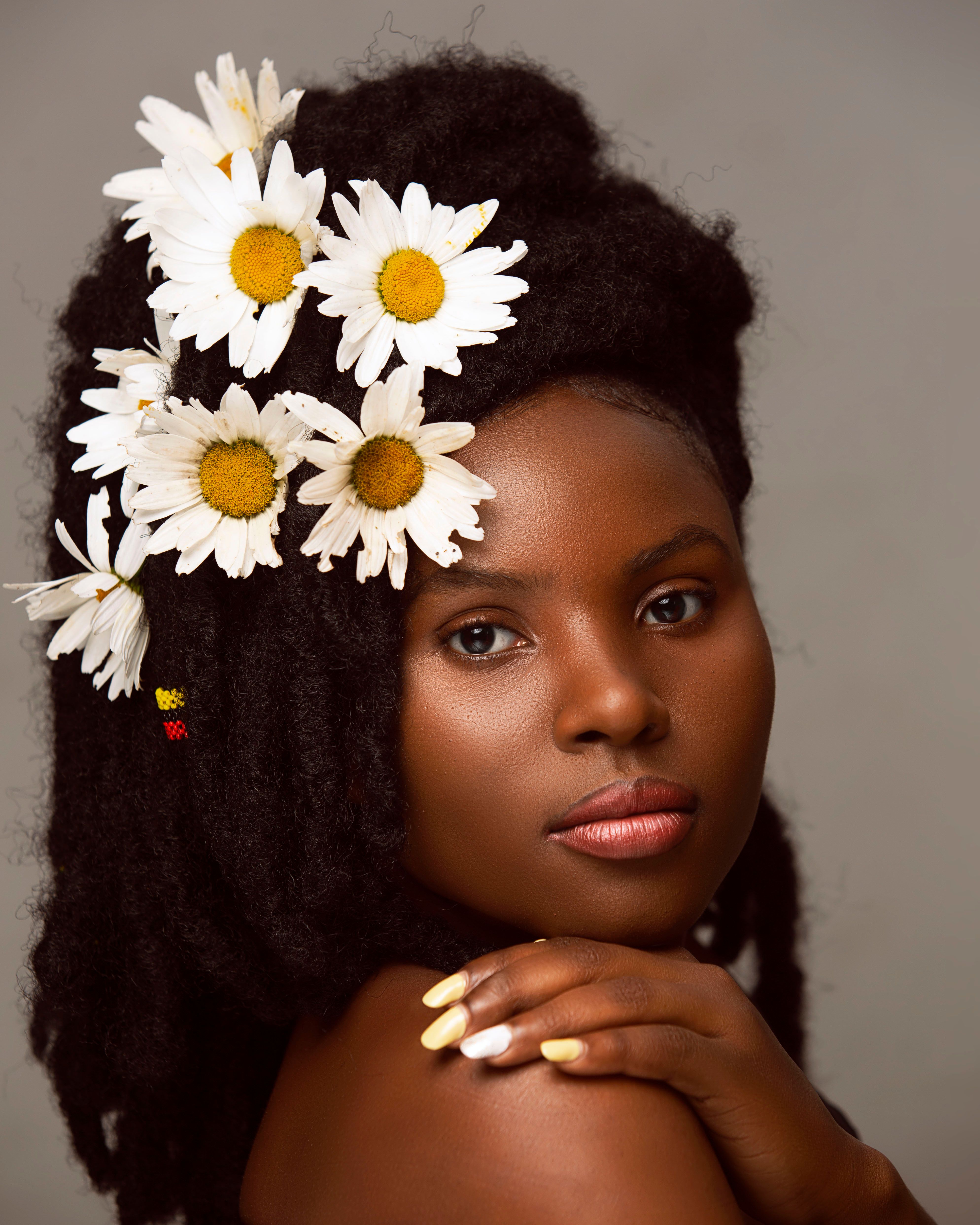 Young Woman with Daisies in Her Hair · Free Stock Photo