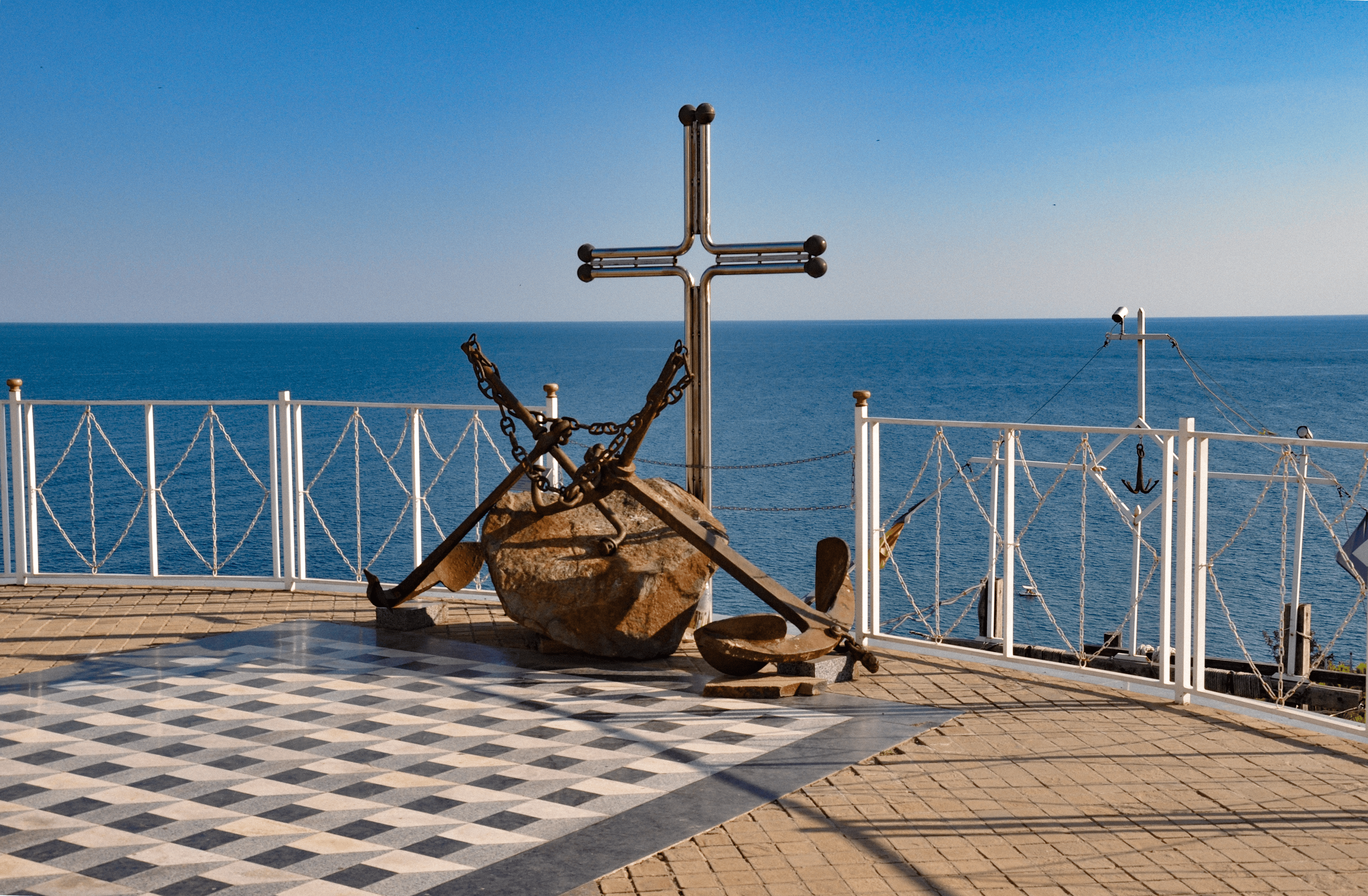 Cross, Anchors and Stone on Sea Shore · Free Stock Photo